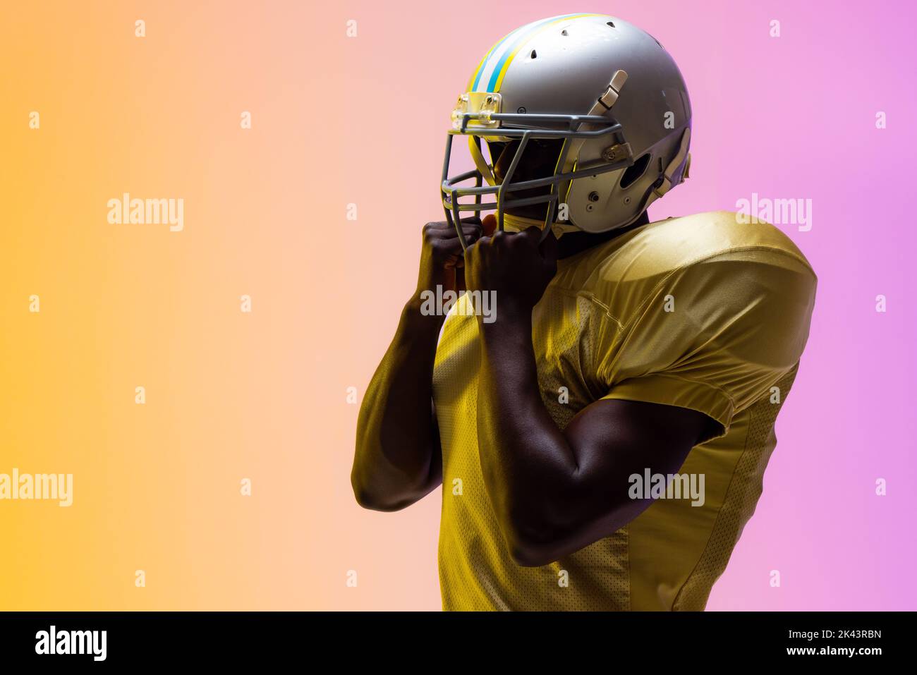 African american male american football player wearing helmet with neon ...