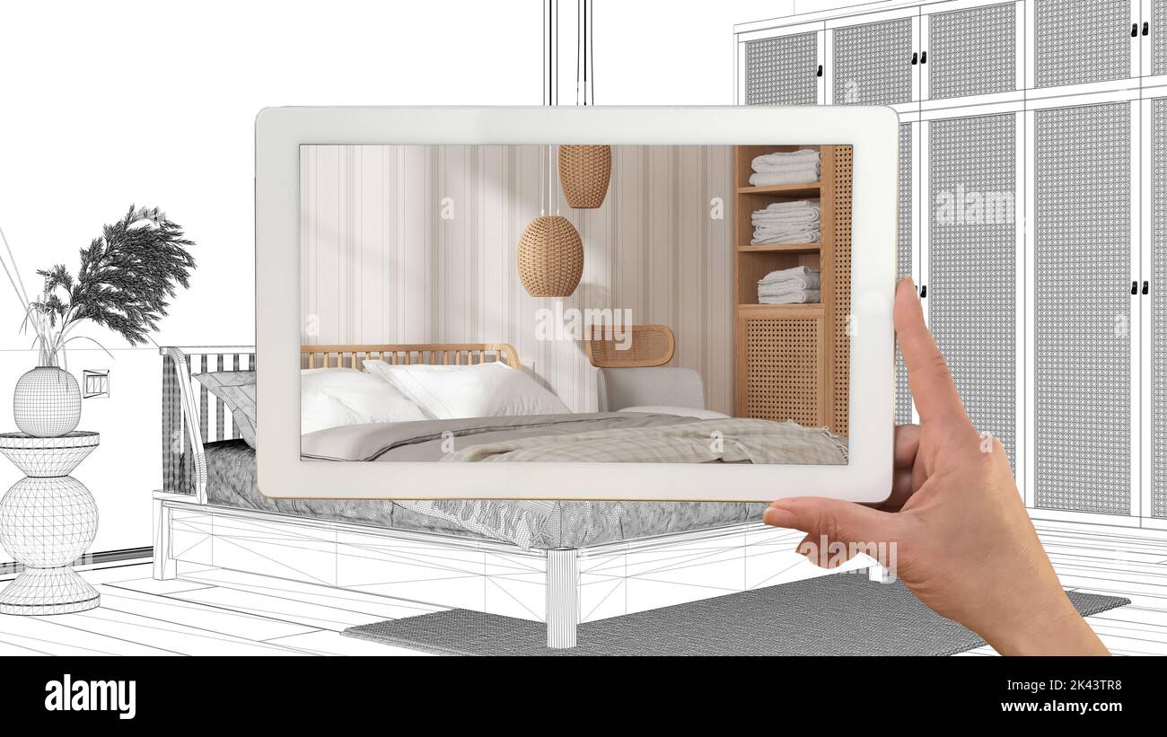 Augmented reality concept. Hand holding tablet with AR application used ...