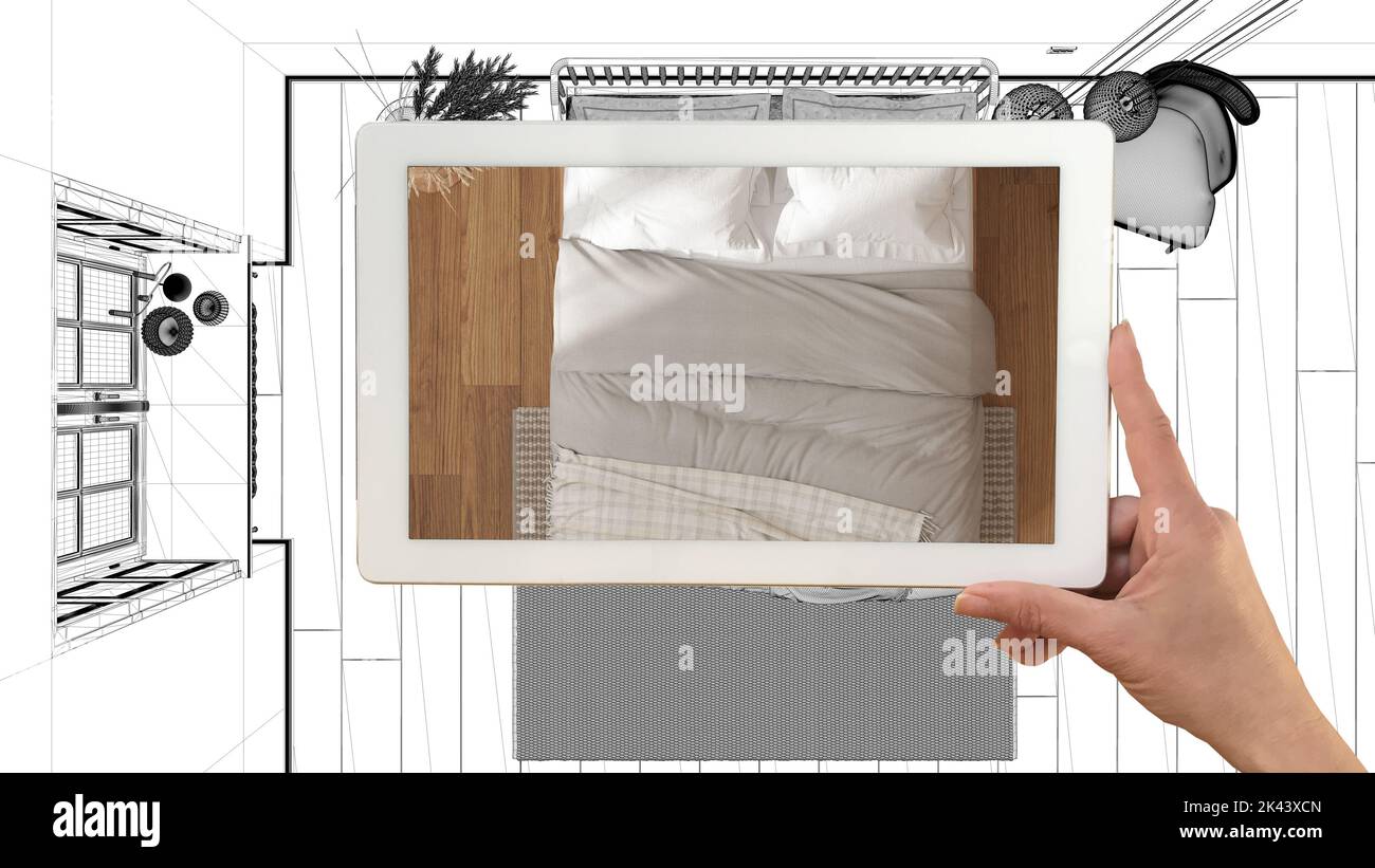 Augmented reality concept. Hand holding tablet with AR application used ...