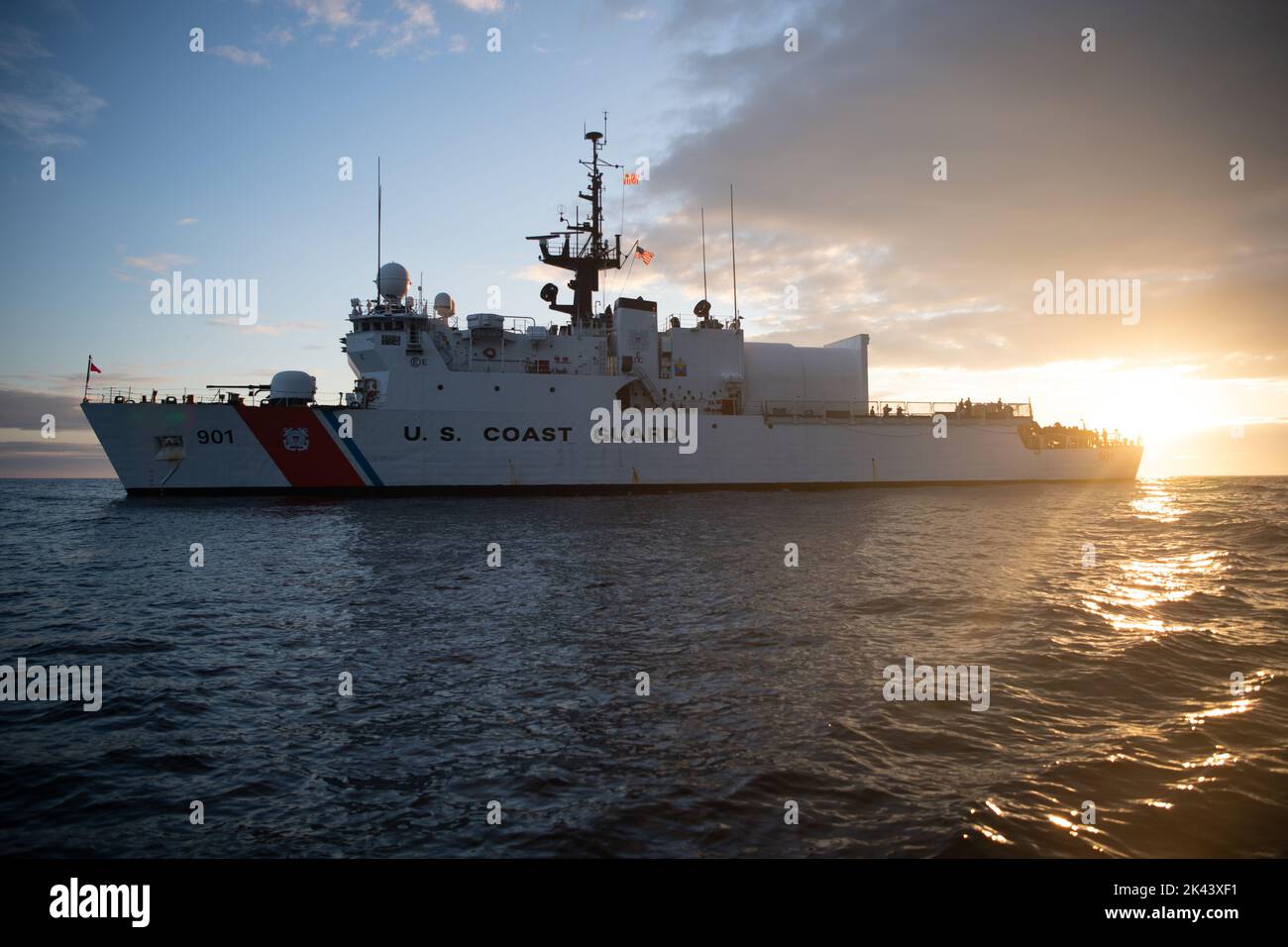 U.S. Coast Guard Cutter Bear (WMEC 901) is seen with the sunset off its ...