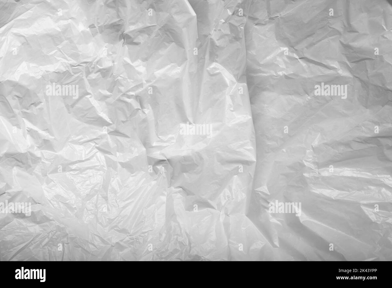 Reflecting light and shadow on creases and folds in scrunched white ...