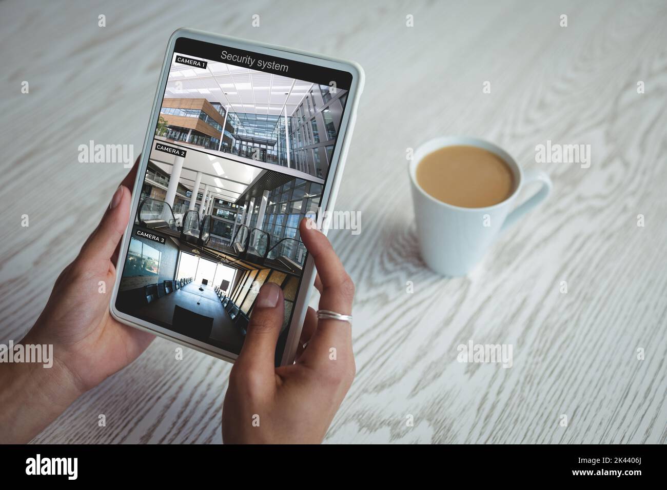 Hands of african american woman holding tablet with views of offices ...