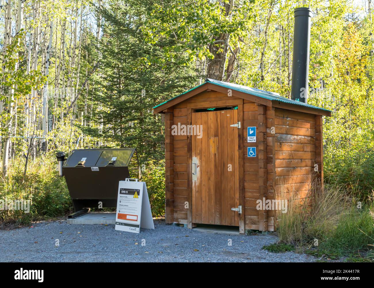 A public restroom in the wood at a rest stop in Banff, Alberta, Canada ...
