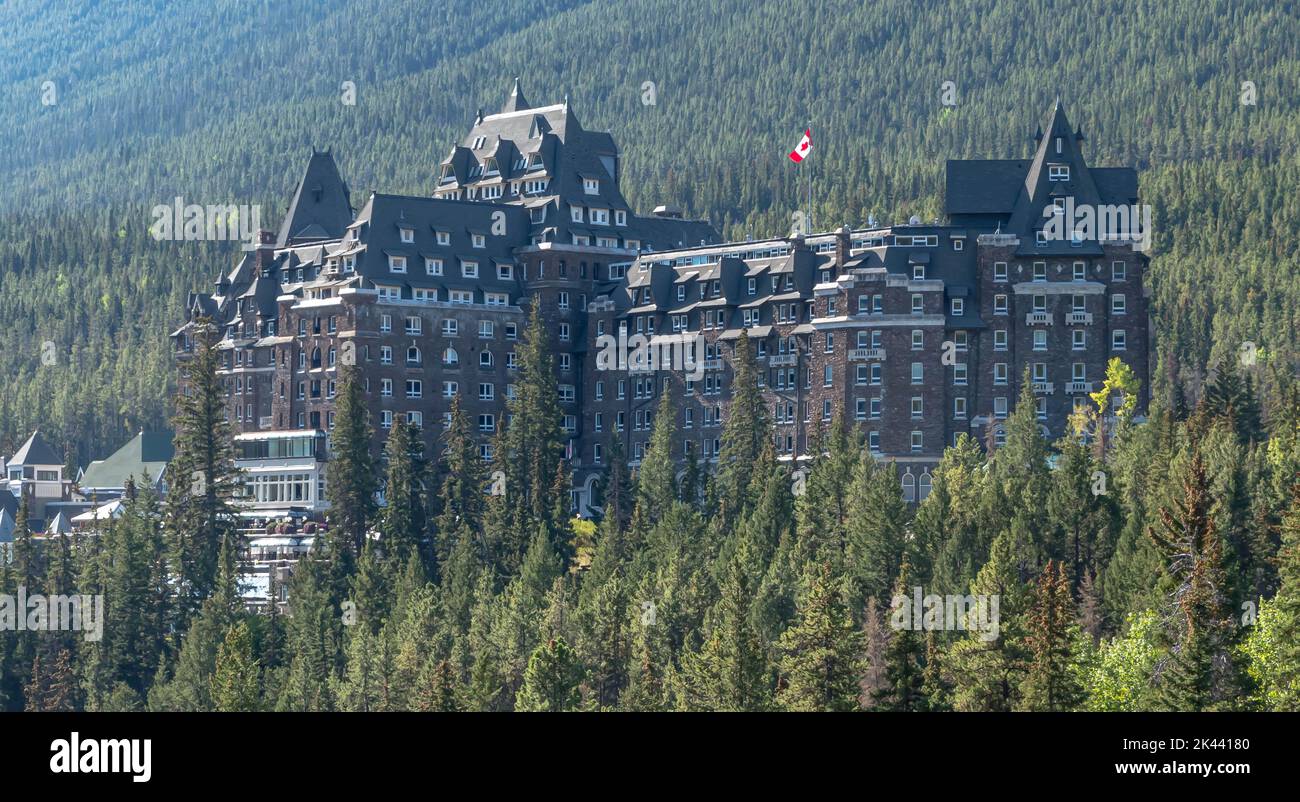The Fairmont Banff Springs Hotel surrounded by evergreen trees in Banff, Alberta, Canada Stock ...