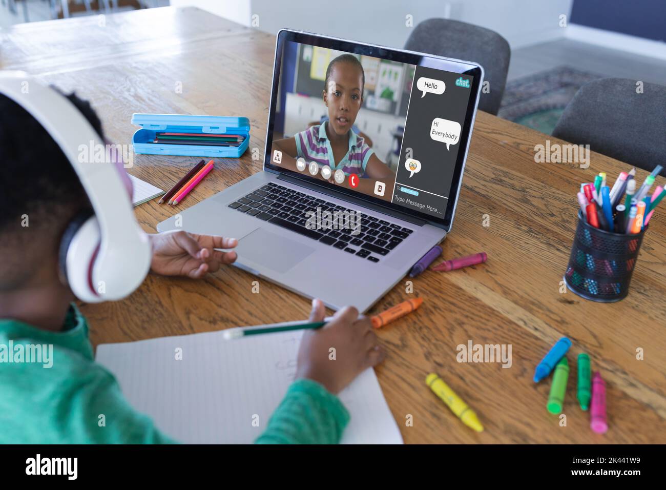 African american boy using laptop for video call, with elementary ...