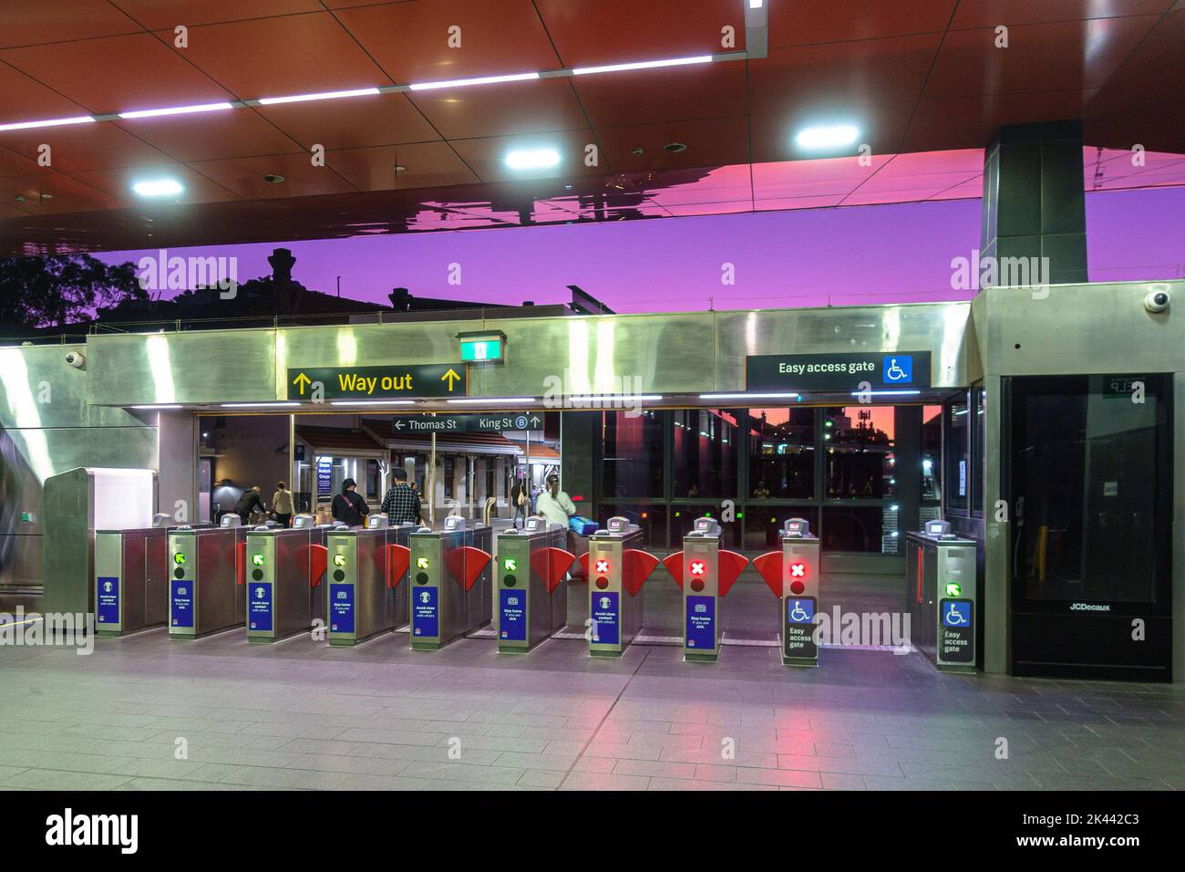 Opal gates at Newtown Train Station at dusk Stock Photo - Alamy