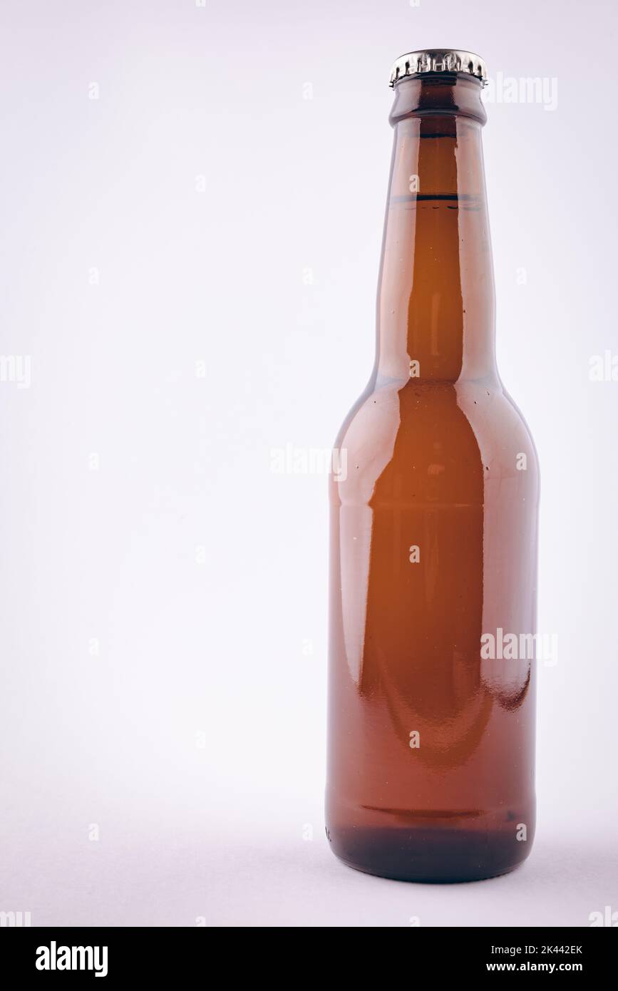 Image of brown glass full lager beer bottle with crown cap, with copy ...