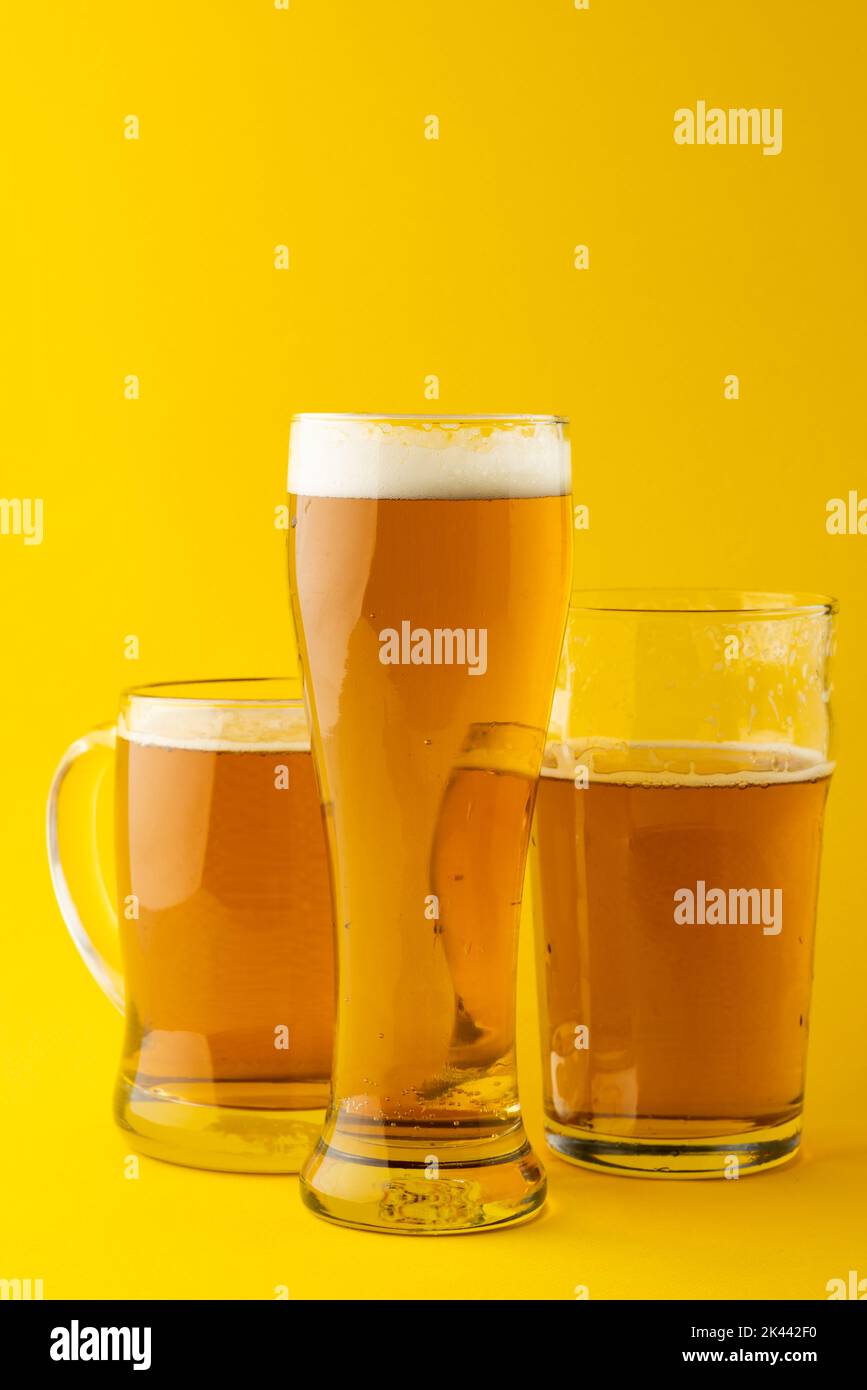 Image of three different pint glasses of lager beer, with copy space on ...