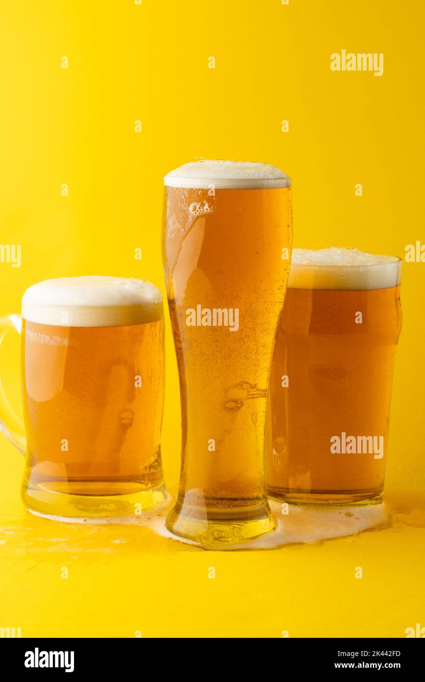 Image of three different full pint glasses of lager beer, with copy ...