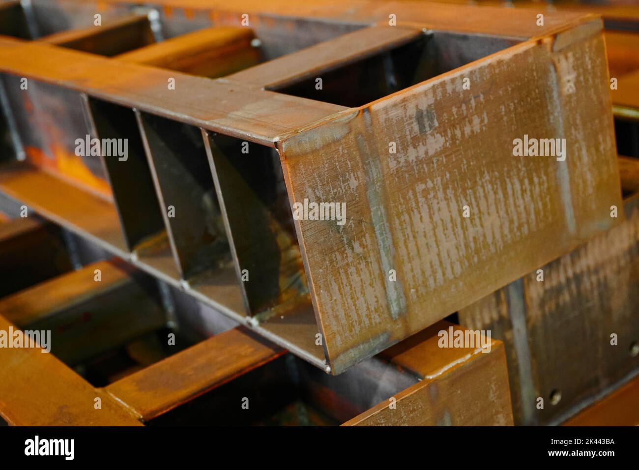 Welded fabrication made of beams stacked in plant warehouse Stock Photo ...