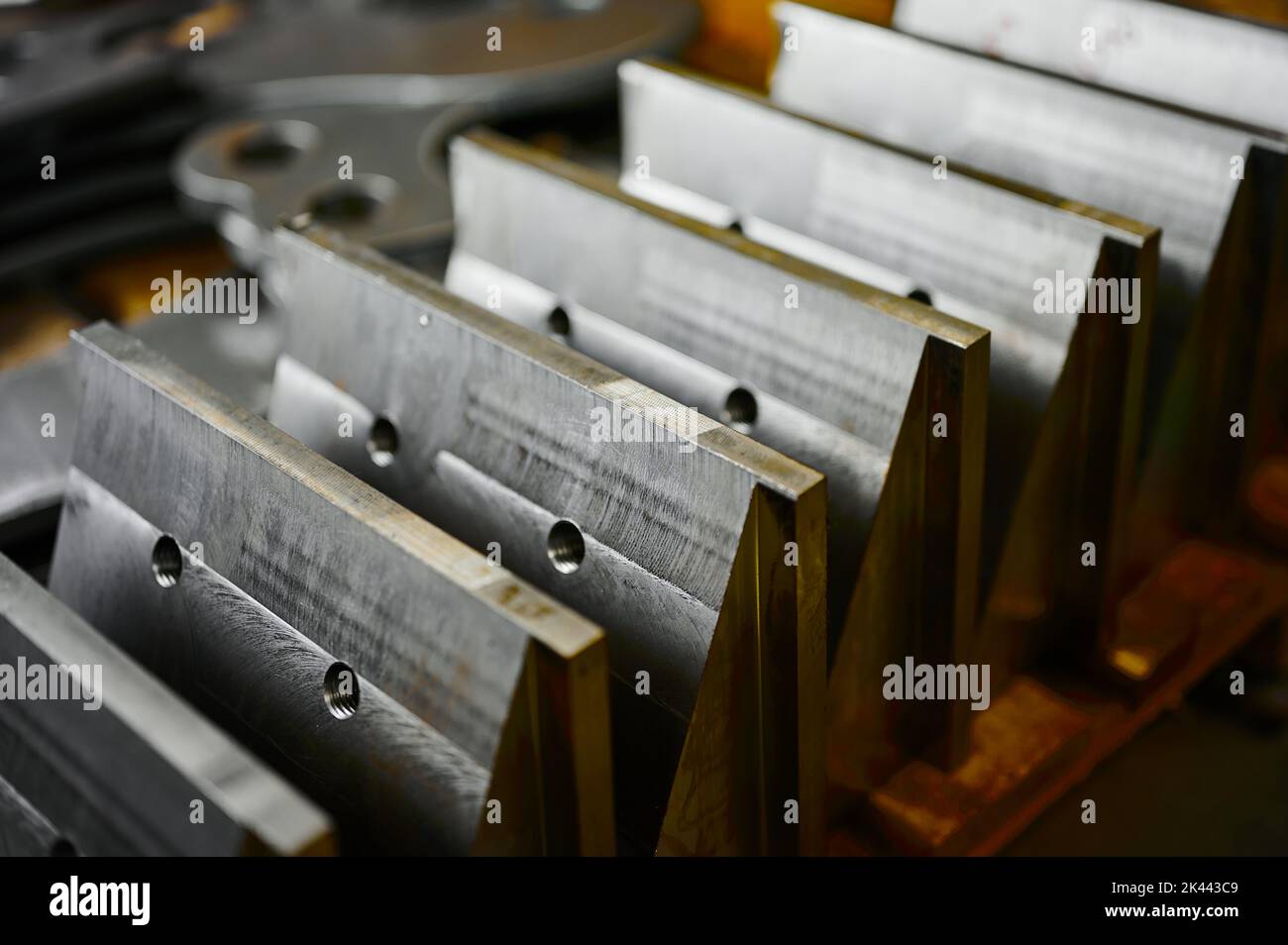 Processed metal plates with ground edges in warehouse Stock Photo - Alamy