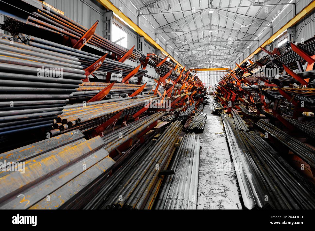 Rolled metal products on large racks in cold storehouse Stock Photo - Alamy