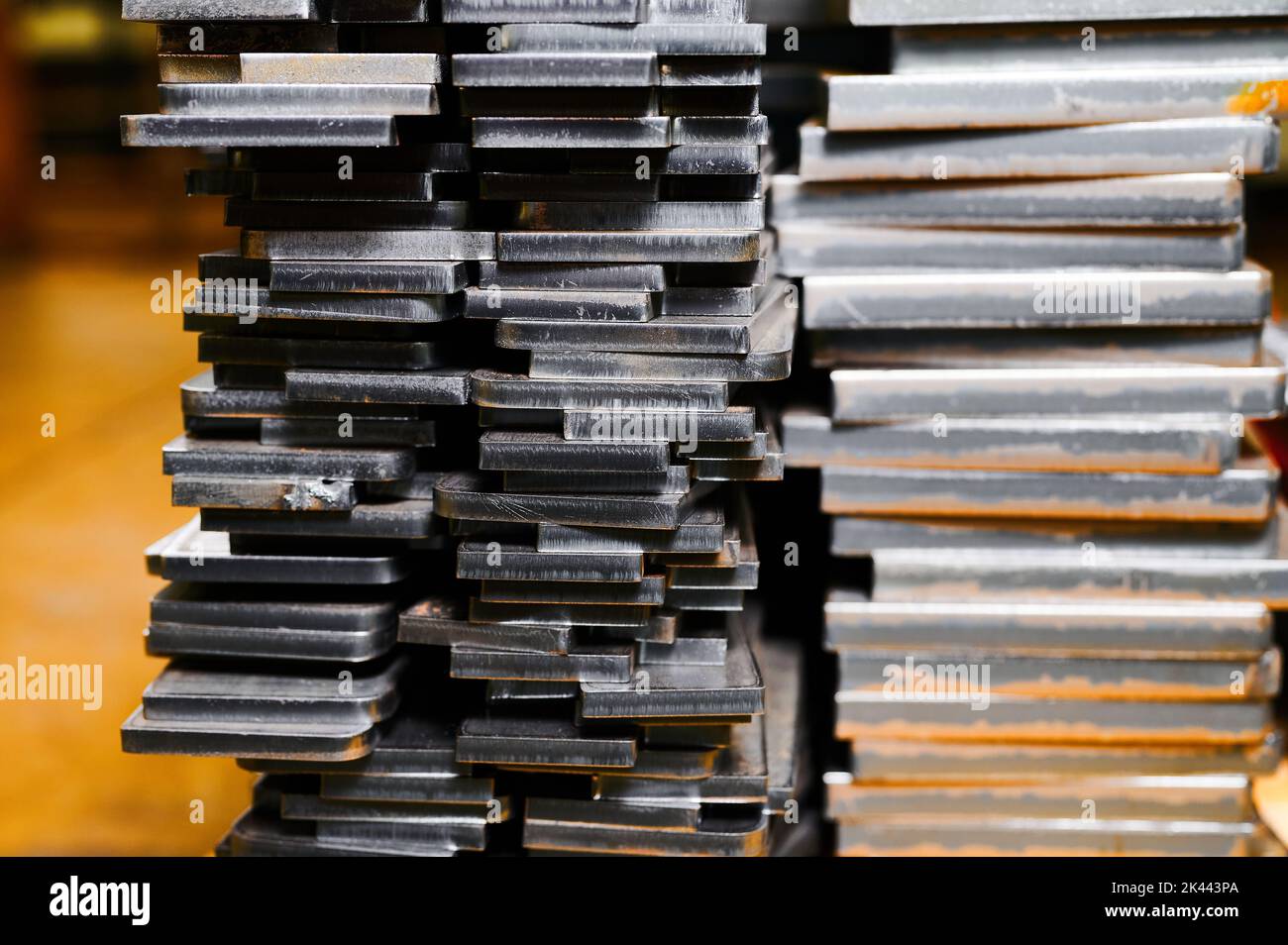 Shiny rectangle metal details in warehouse Stock Photo - Alamy