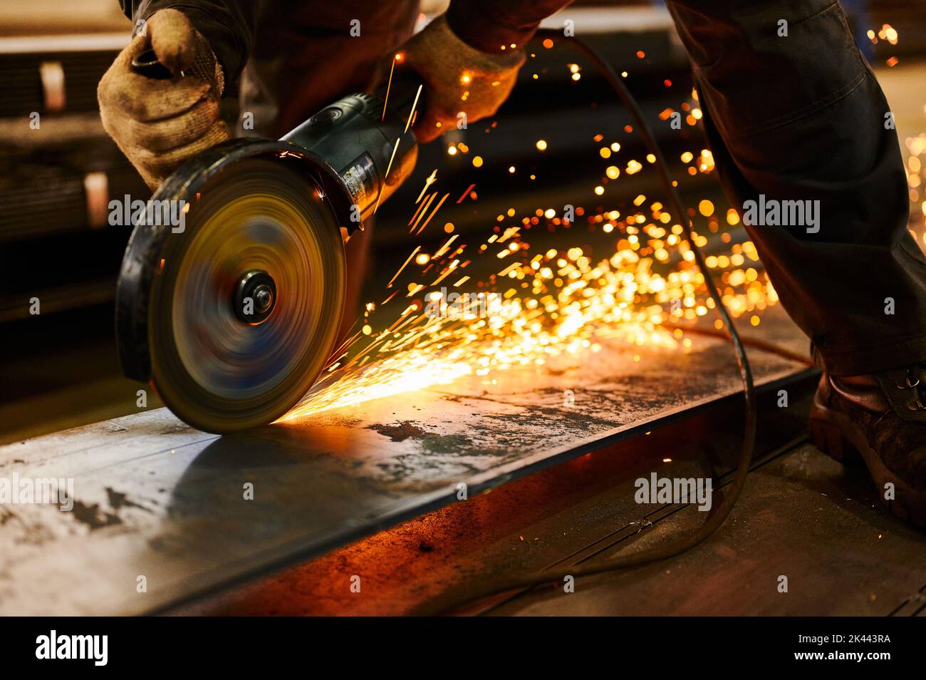 Metal plate cutting with abrasive disk and splashing sparks Stock Photo ...