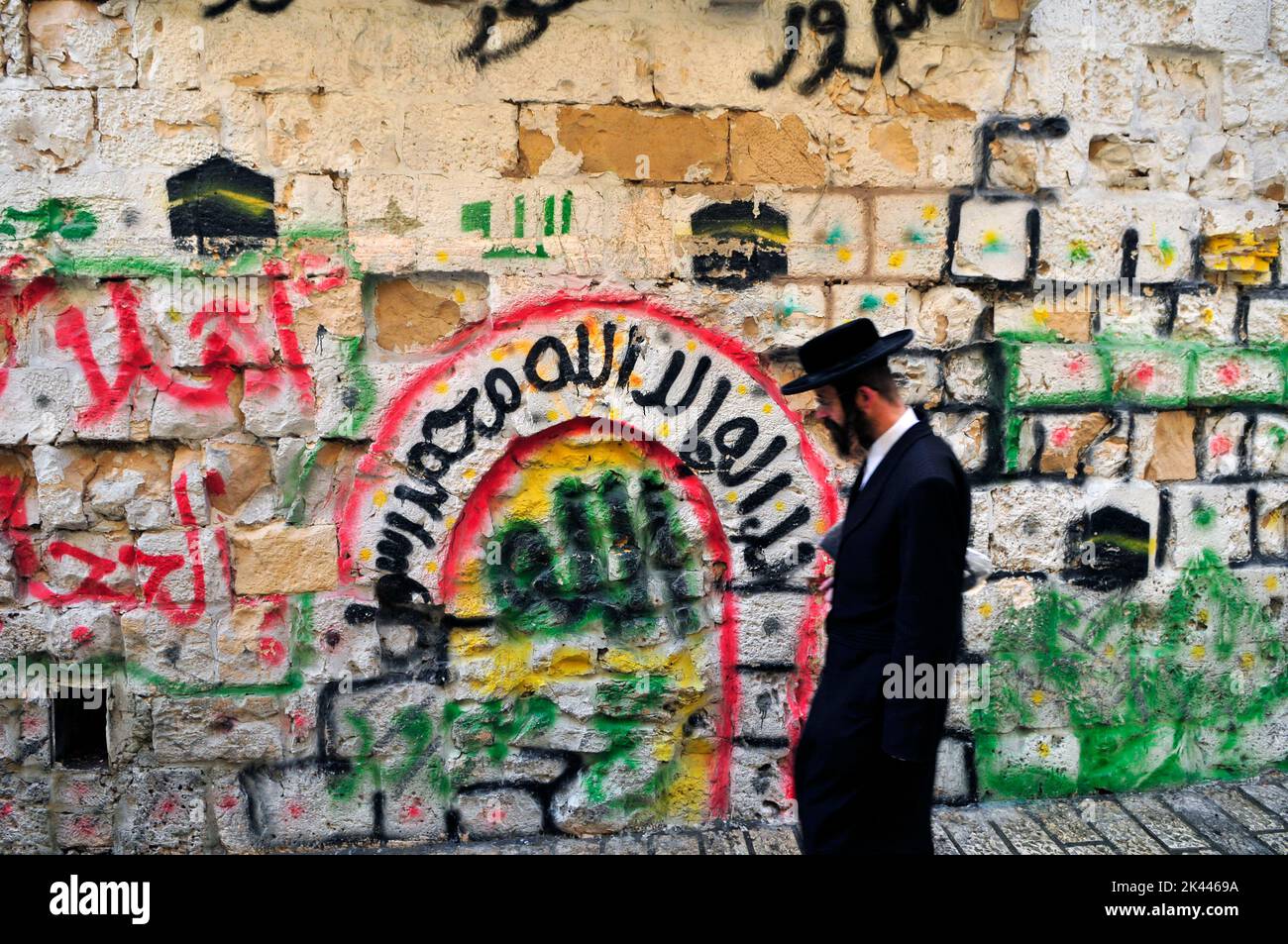 Muslim Quarter, Jerusalem. December 2009.An Orthodox Jewish man walking ...