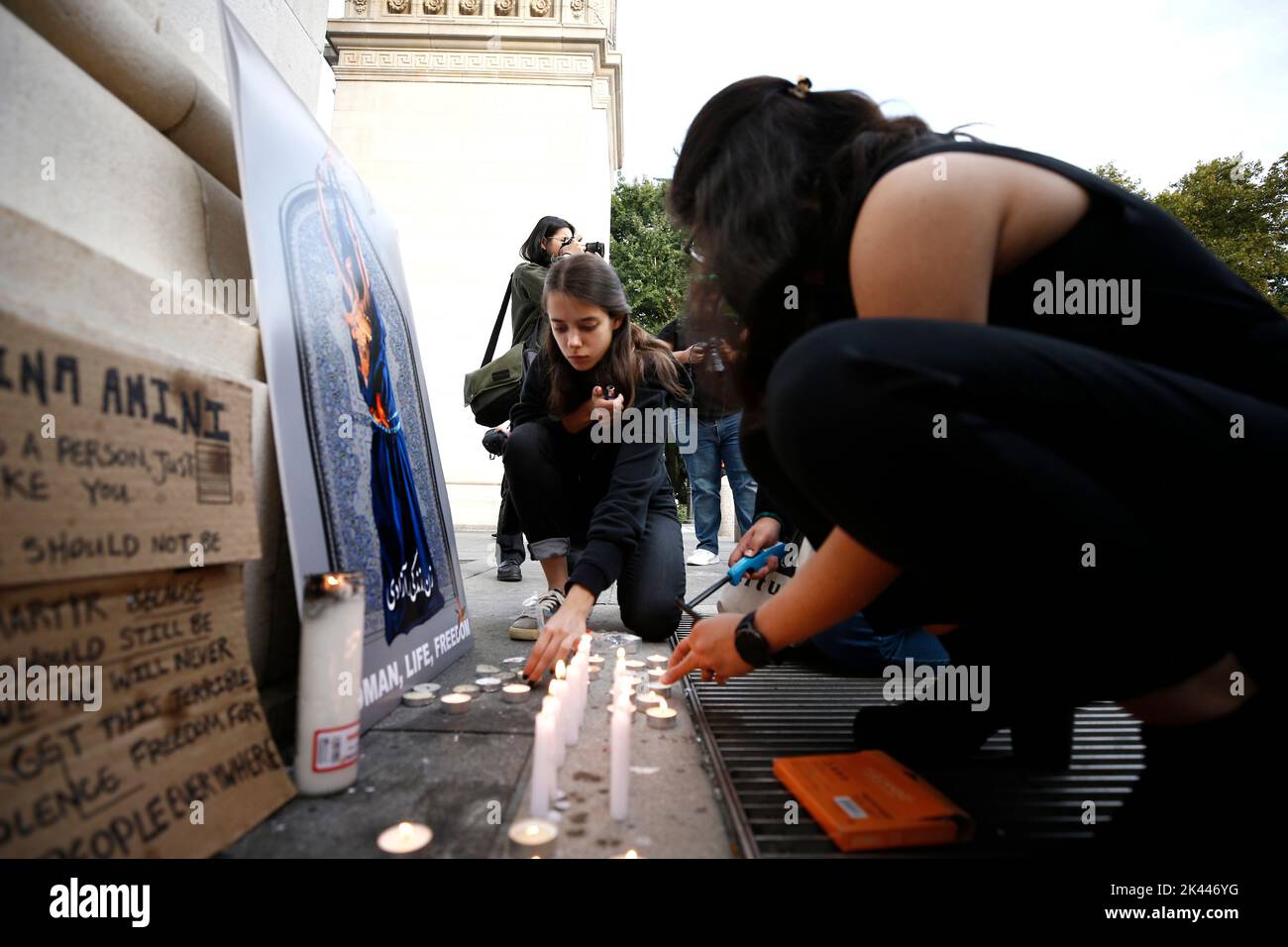 New York City, USA. 29th Sep, 2022. People hold a vigil for Masha Amini ...