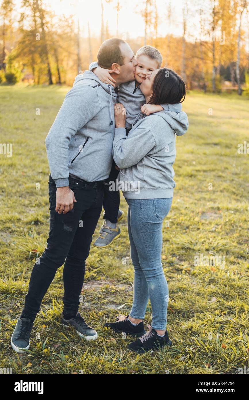 Parents kissing their children hi-res stock photography and images - Alamy