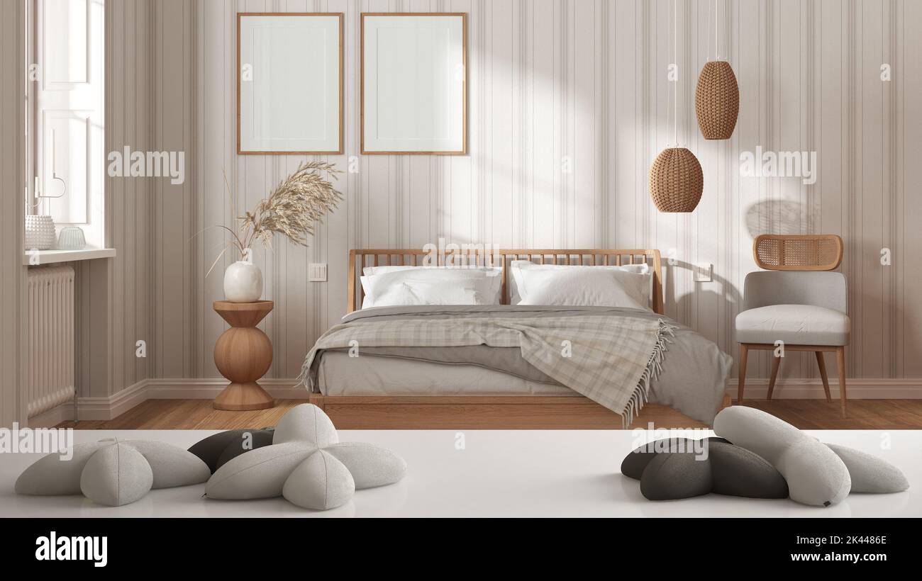 White table, desk or shelf with five soft white pillows in the shape of ...