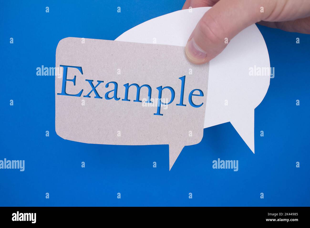 Speech bubble in front of colored background with Example text Stock ...