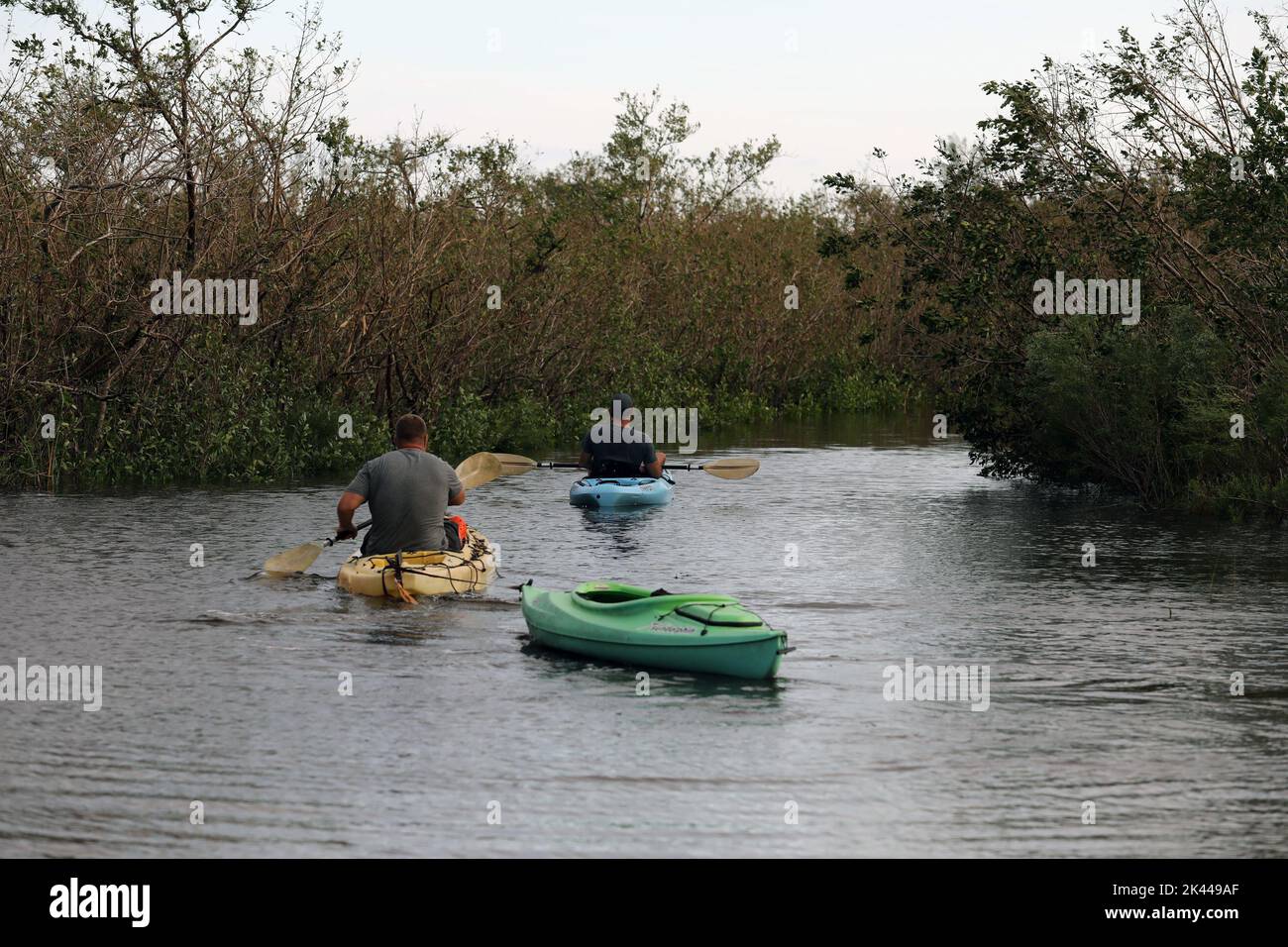 Fort Myers, United States. 29th Sep, 2022. Two men kayak down flooded ...