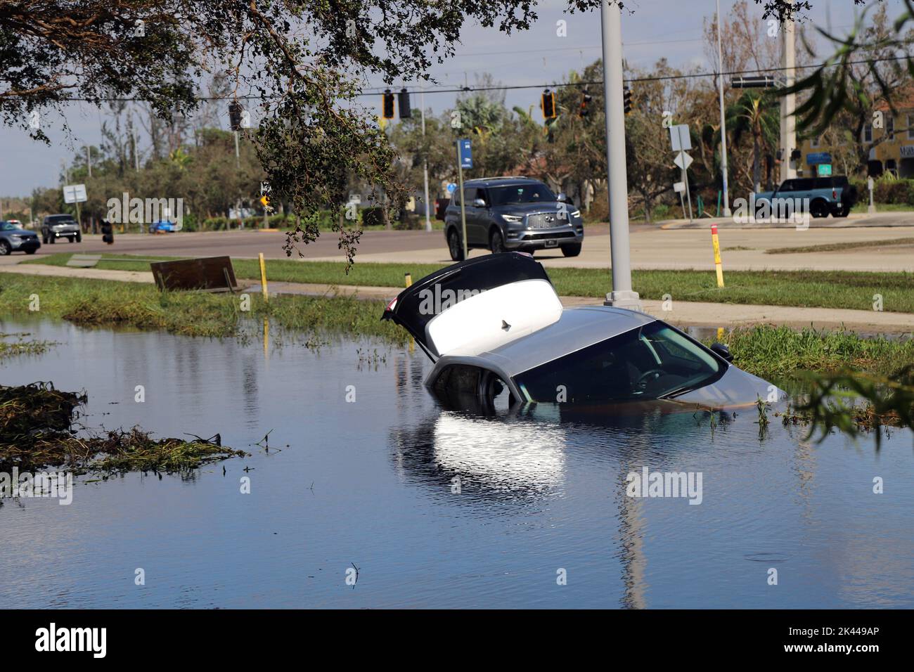 Fort Myers, United States. 29th Sep, 2022. Cars are in a flooded ditch ...