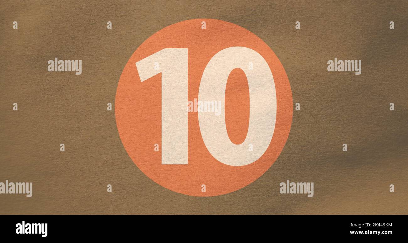 Composition of number 10 in red spot on brown background. Number and ...