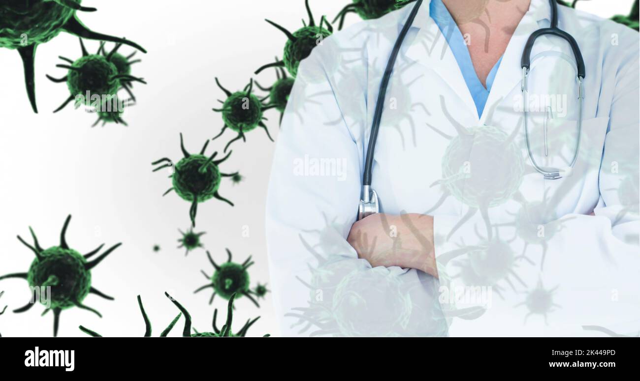 Image of midsection of caucasian doctor with stethoscope over green ...