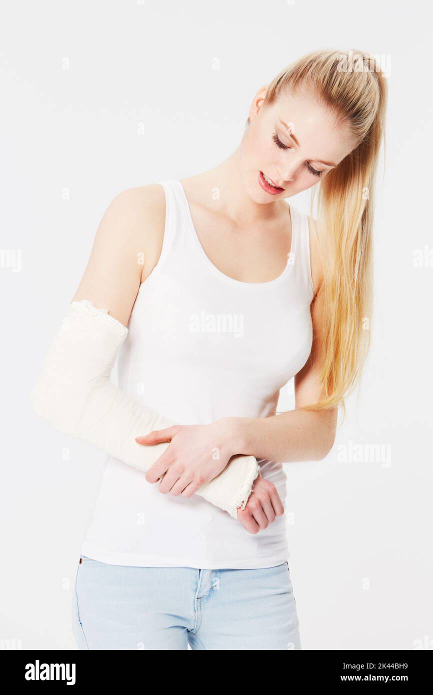 The after affects of a broken bone. Caucasian girl against an isolated ...