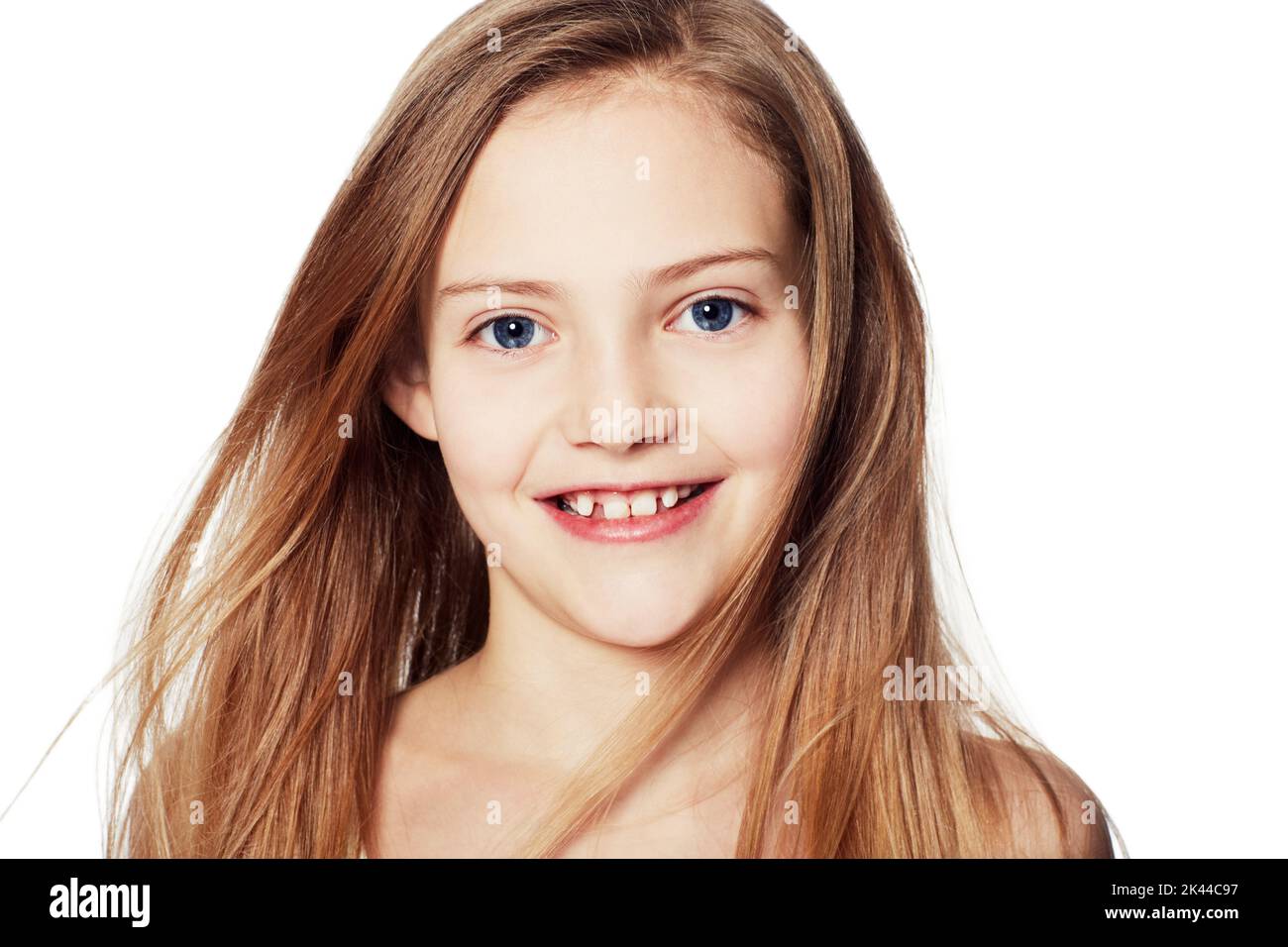 Cute and innocent smile. Cropped view of a cute little girl smiling ...
