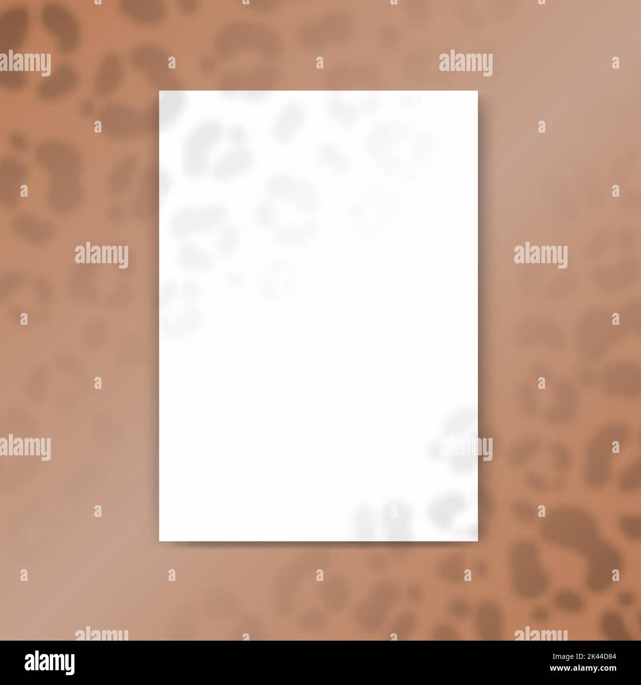 Mock up of empty paper blank. Reflected cheetah print shadow from ...