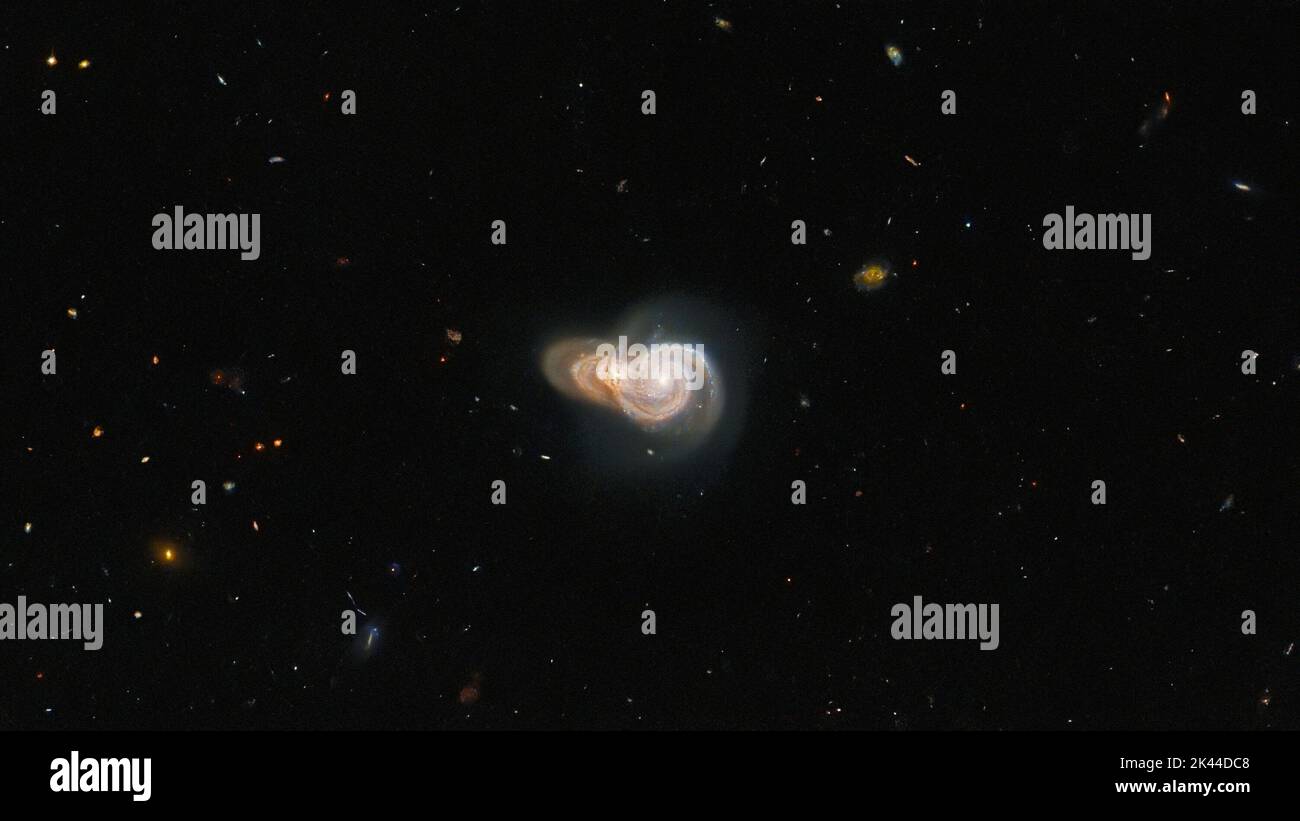 Space. 5th Sep, 2022. Two overlapping spiral galaxies are pictured in ...