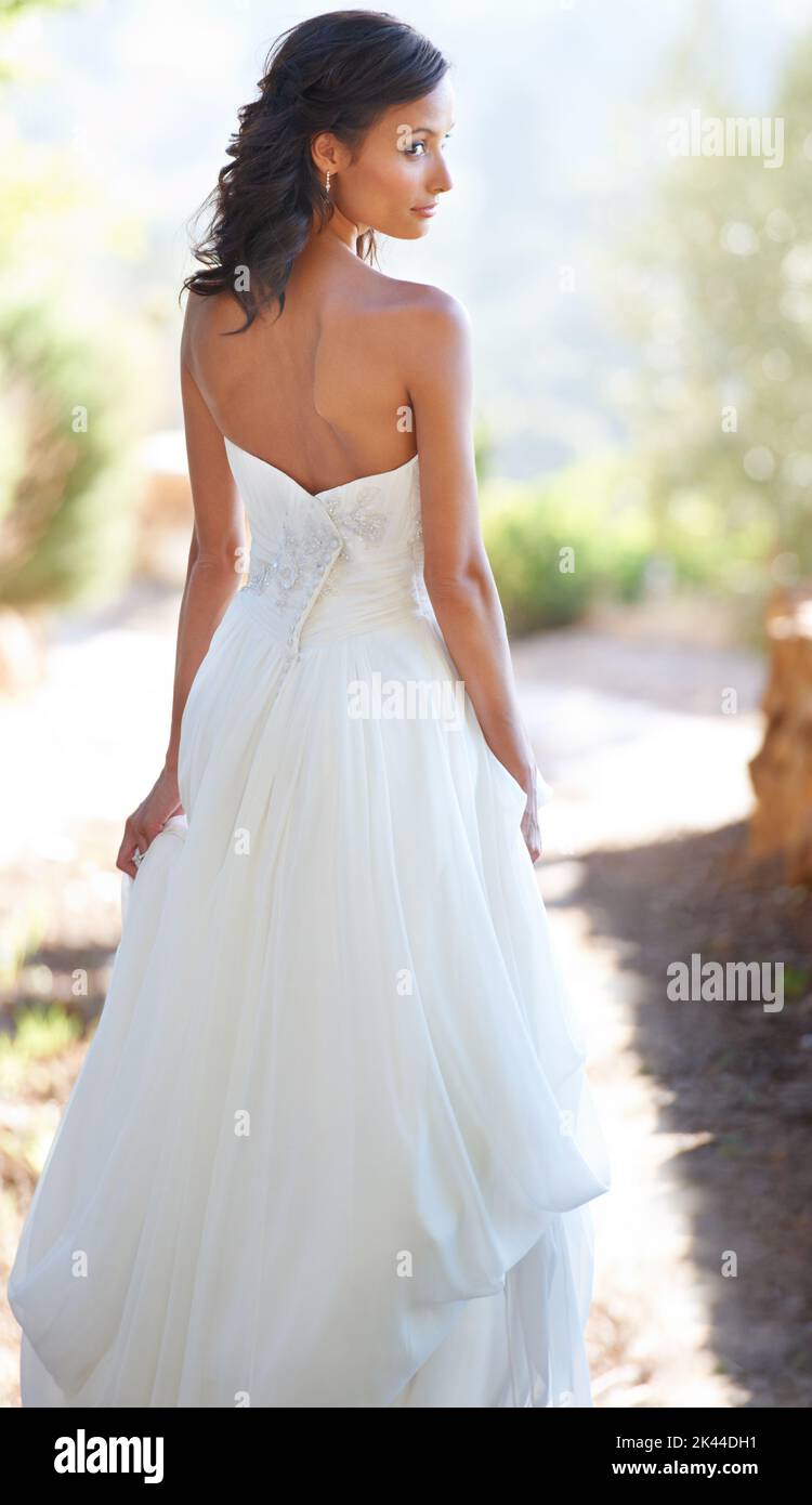 Taking her first steps towards her new life - Wedding day. A young ...