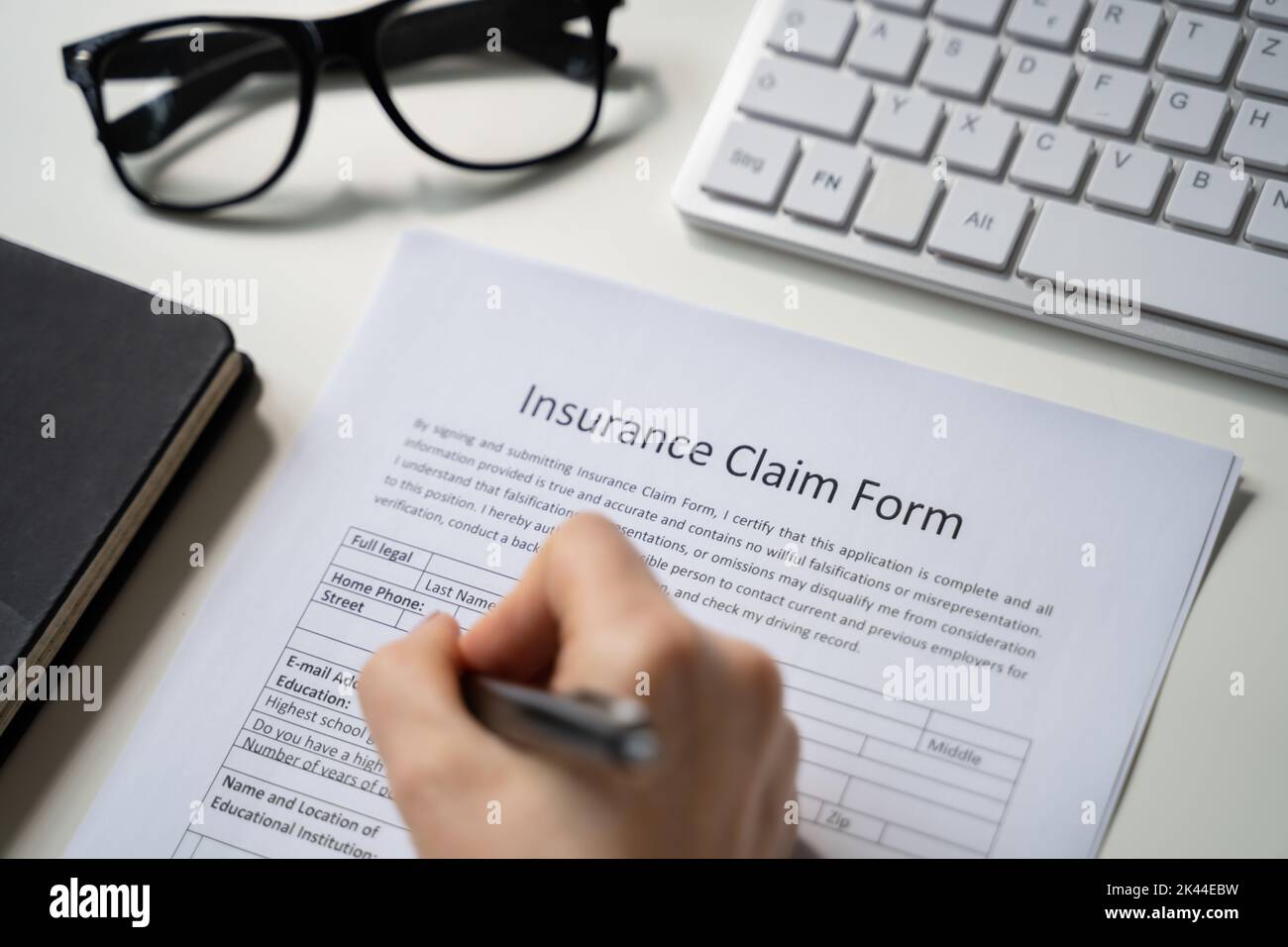 Hand Filling Health Insurance Claim Form. Closeup Shot Stock Photo - Alamy