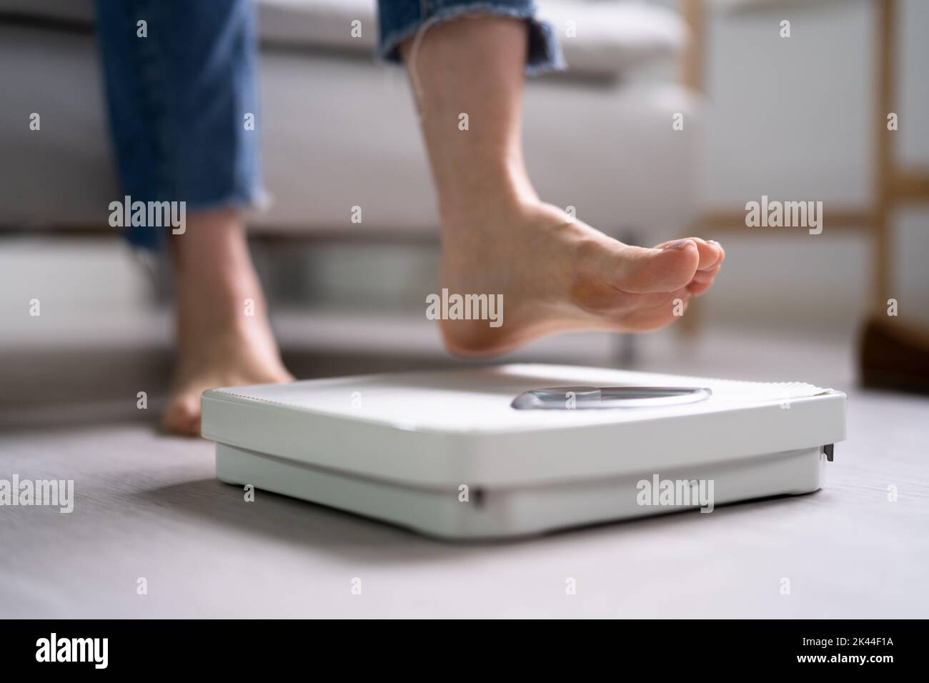High Angle View Of Woman Measuring Body Weight On Weighing Scale Stock ...