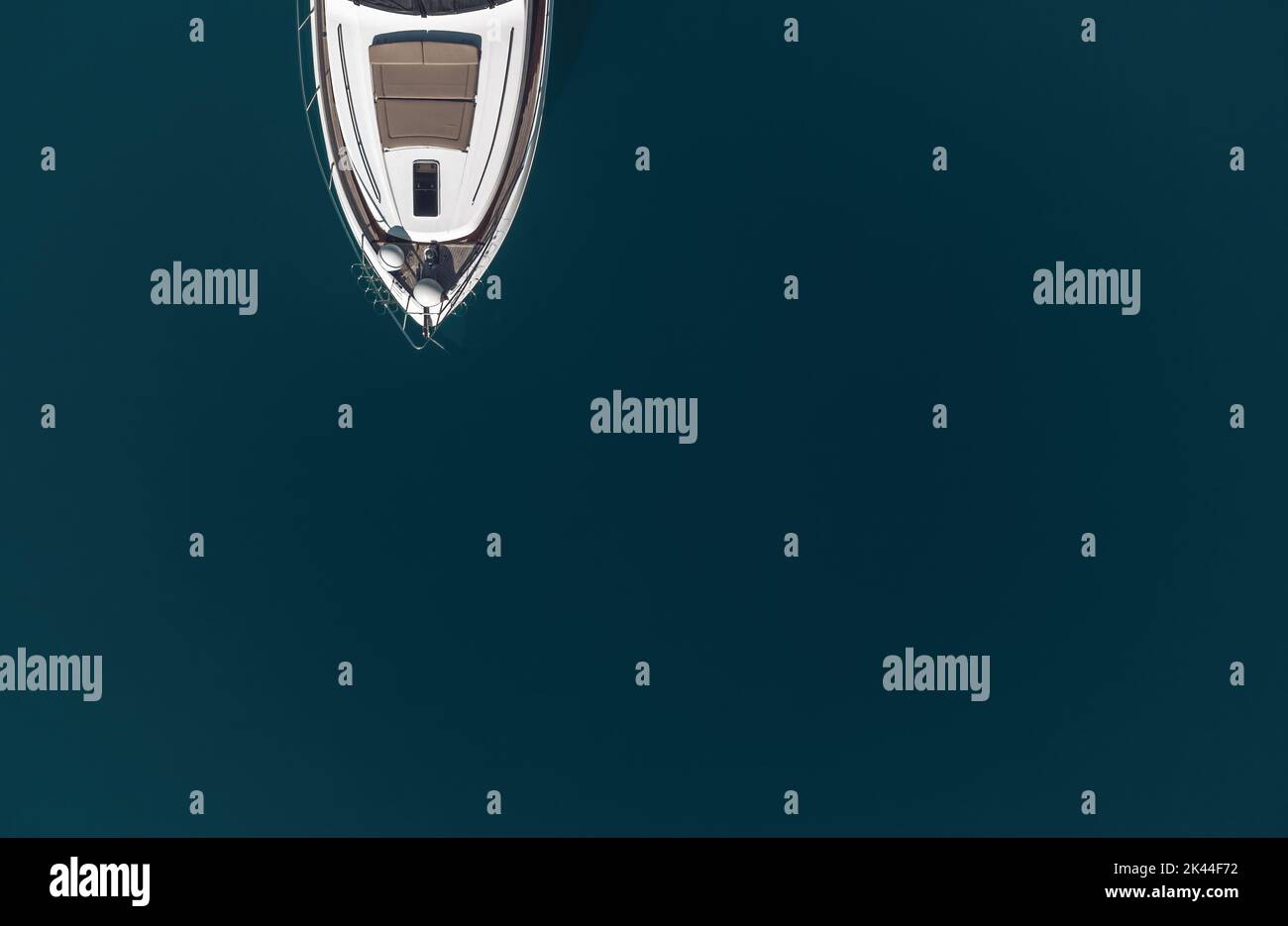 Aerial yacht on calm sea. Luxury cruise trip. View from above of white ...
