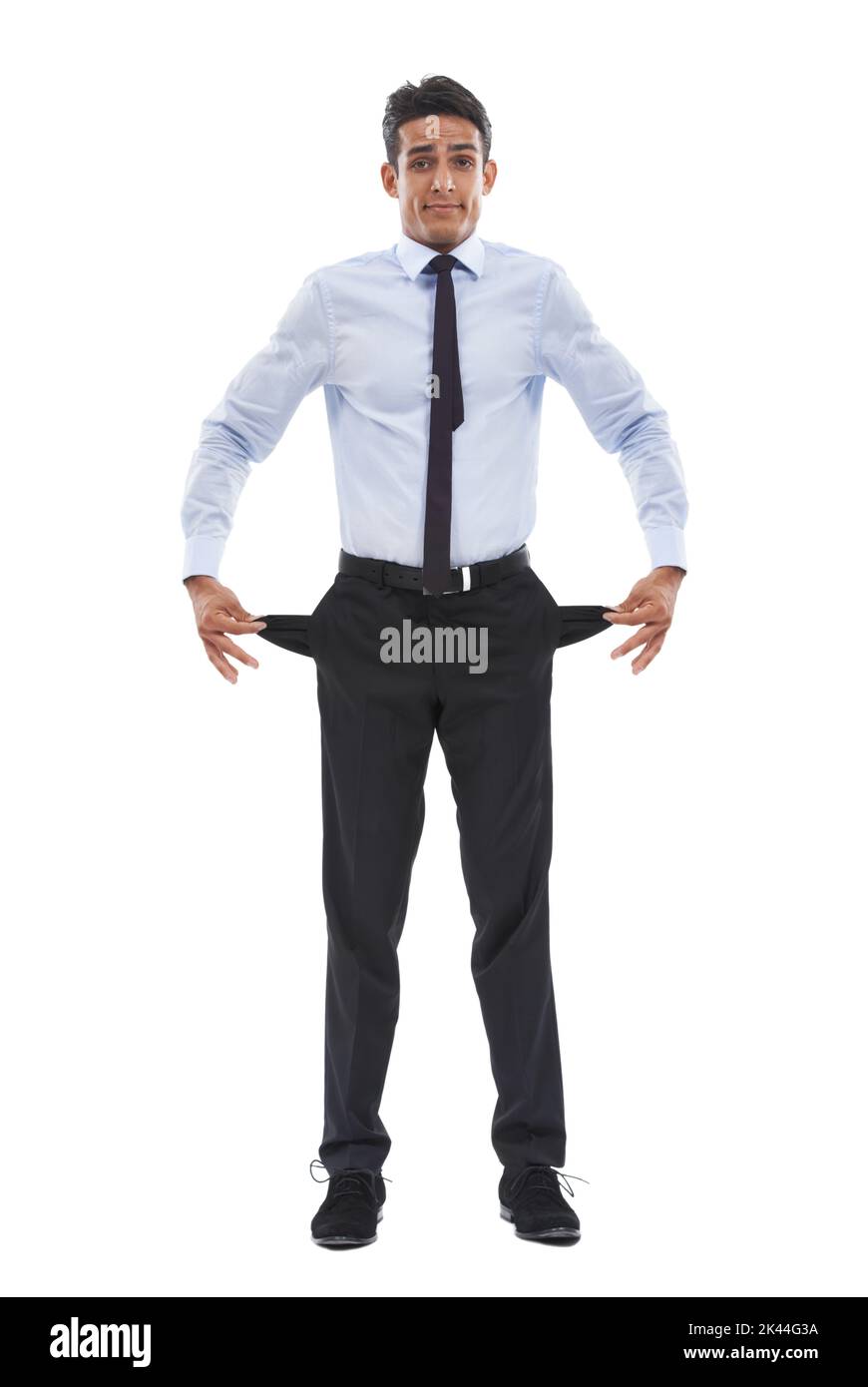 Every business goes through tough times. Portrait of a handsome businessman pulling out his ...