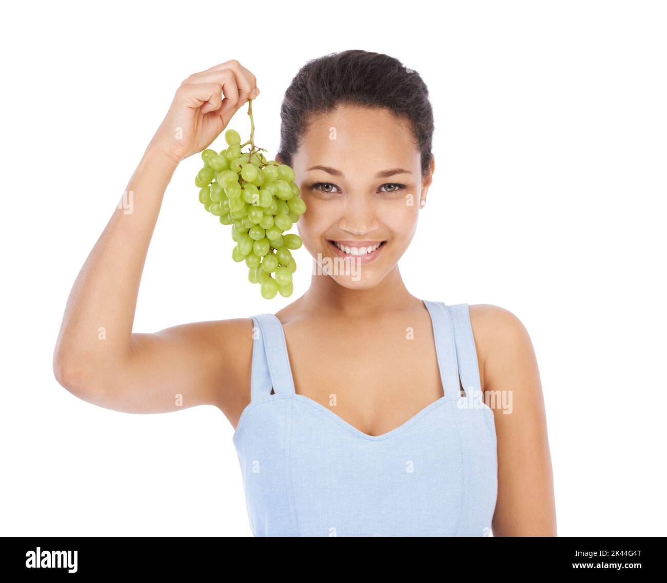 Would you like some. Young woman smiling while holding up a bunch of ...