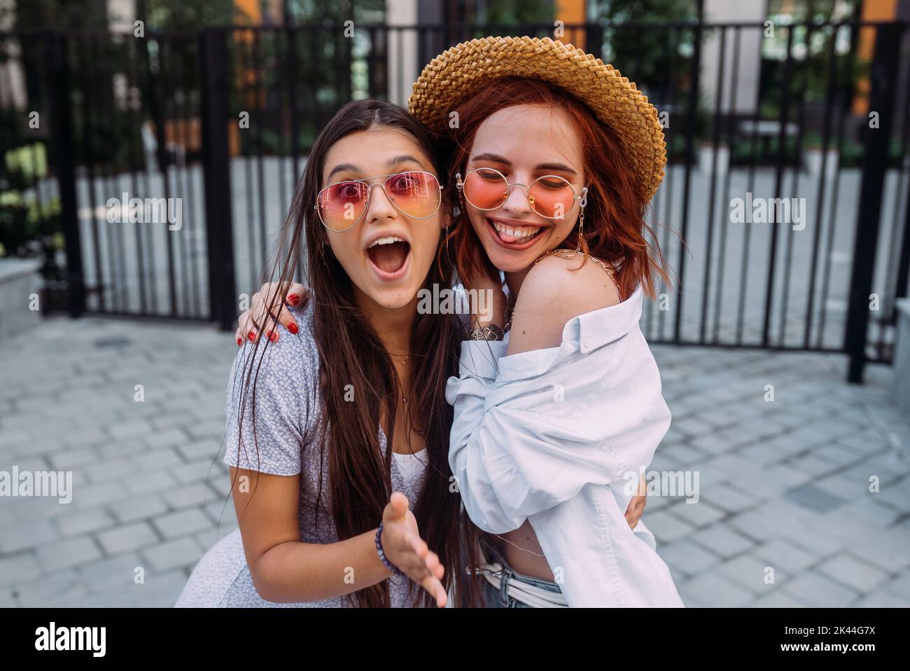 Two girlfriends having fun and fooling around Stock Photo - Alamy