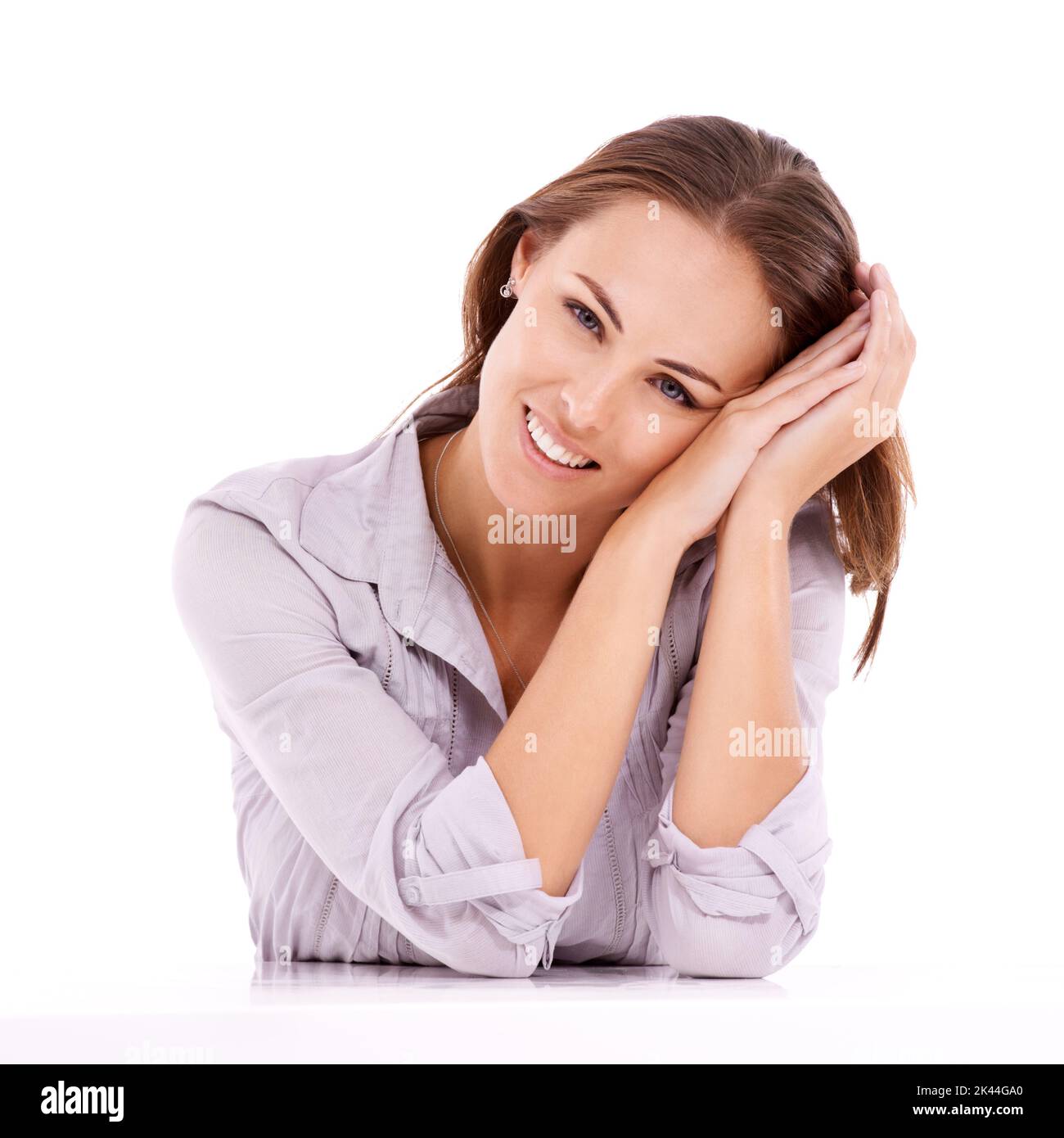 Beautiful and relaxed. Casually dressed woman sitting and looking ...