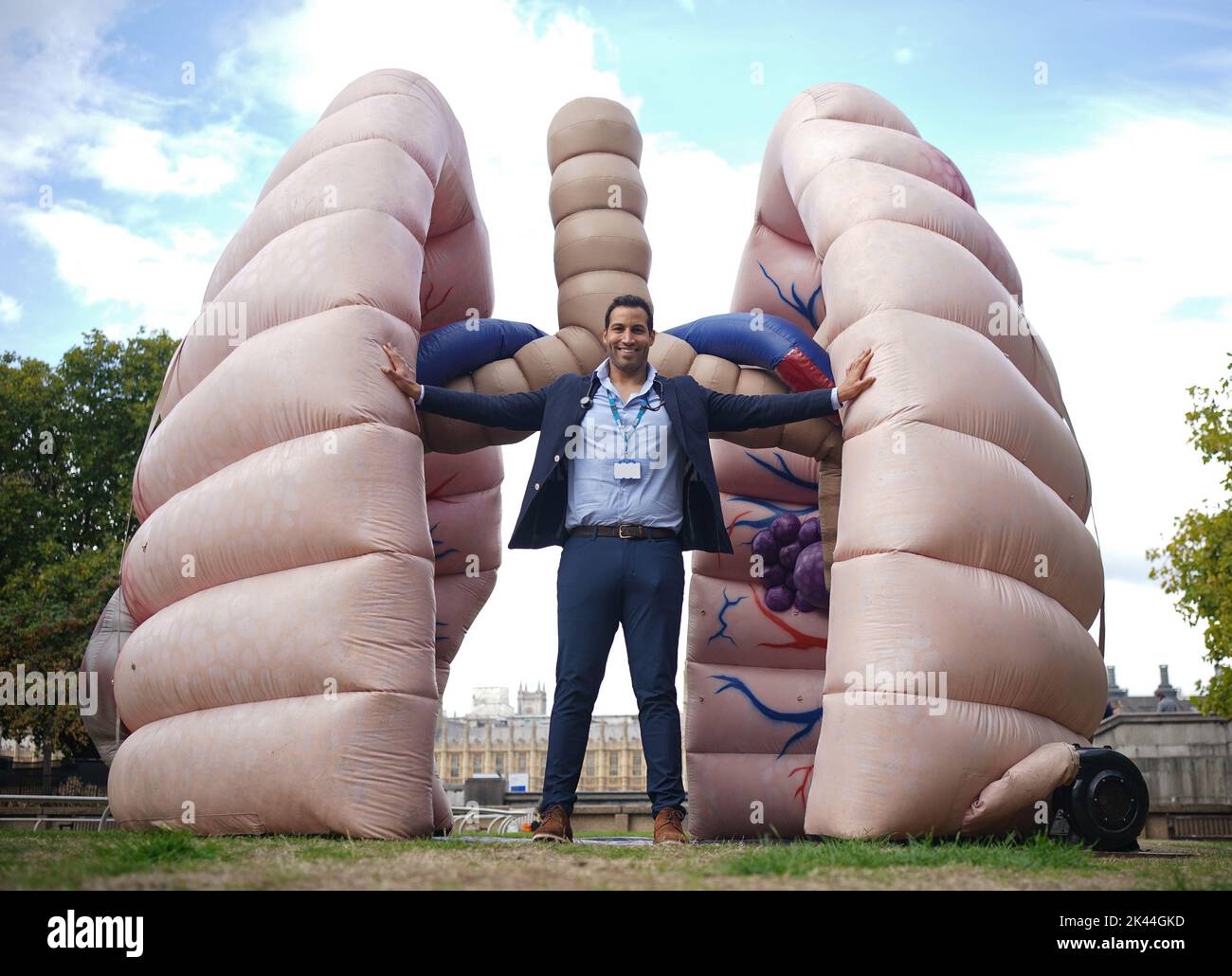 Dr Chris George, NHS medical doctor, beside a large inflatable lung at ...