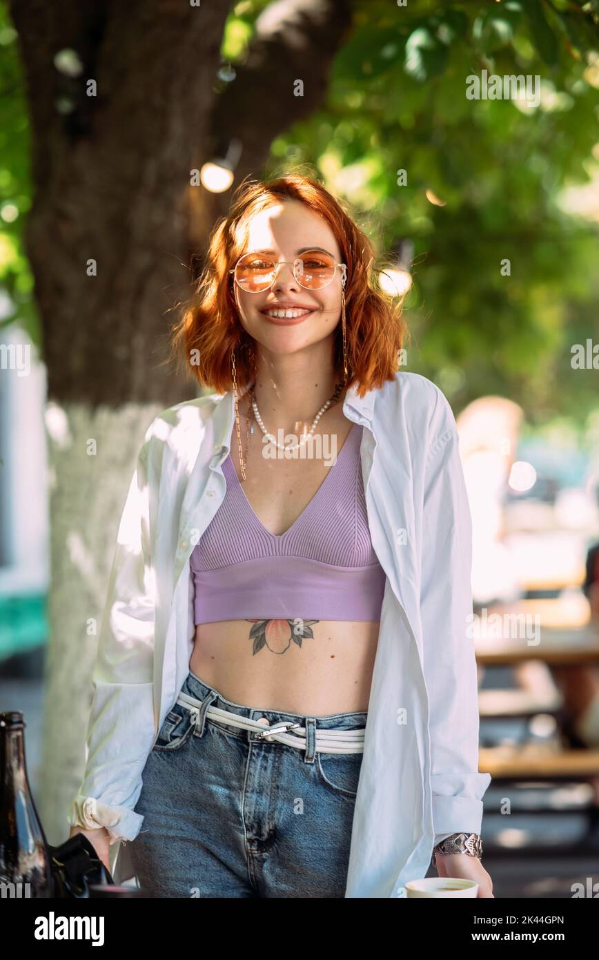 Young woman with toothy smile in outdoors Stock Photo - Alamy