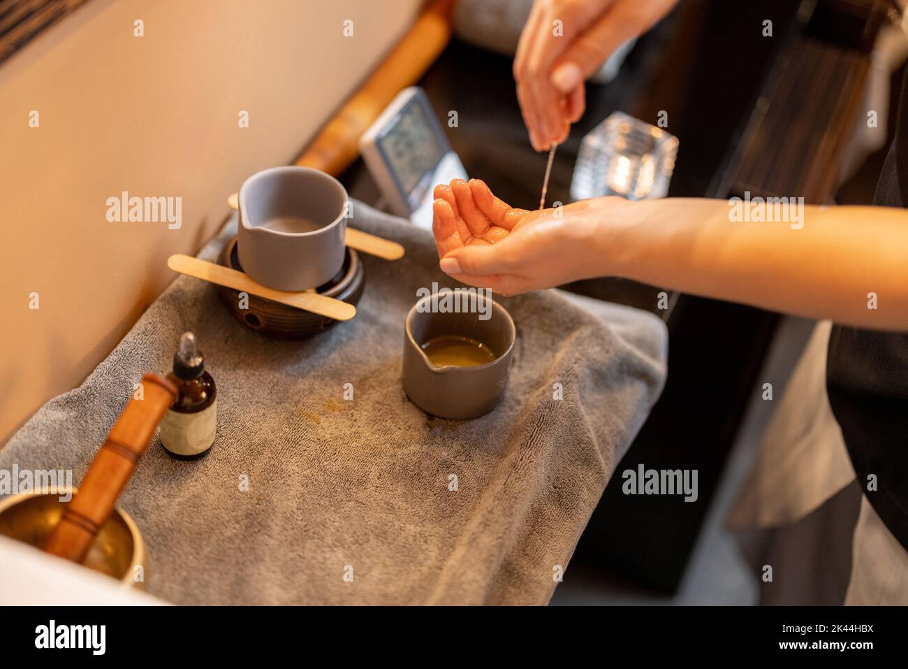Woman hands applying oil hi-res stock photography and images - Alamy