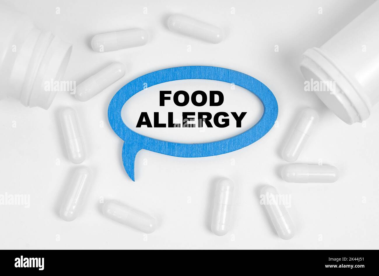 Medicine concept. On the table there are pills and a blue plaque inside ...