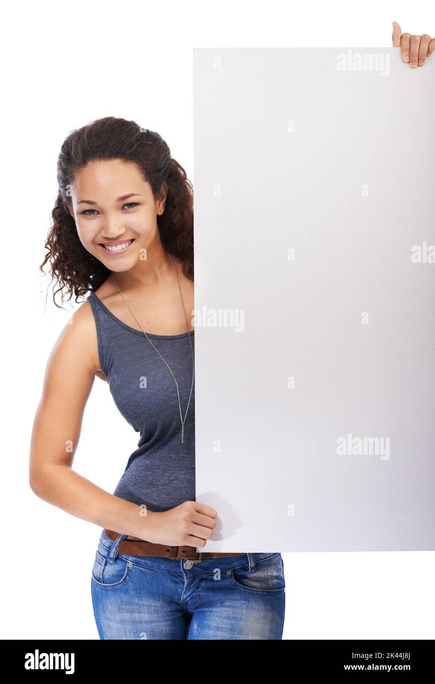 Displaying your advert. Portait of a beautiful young woman holding a ...