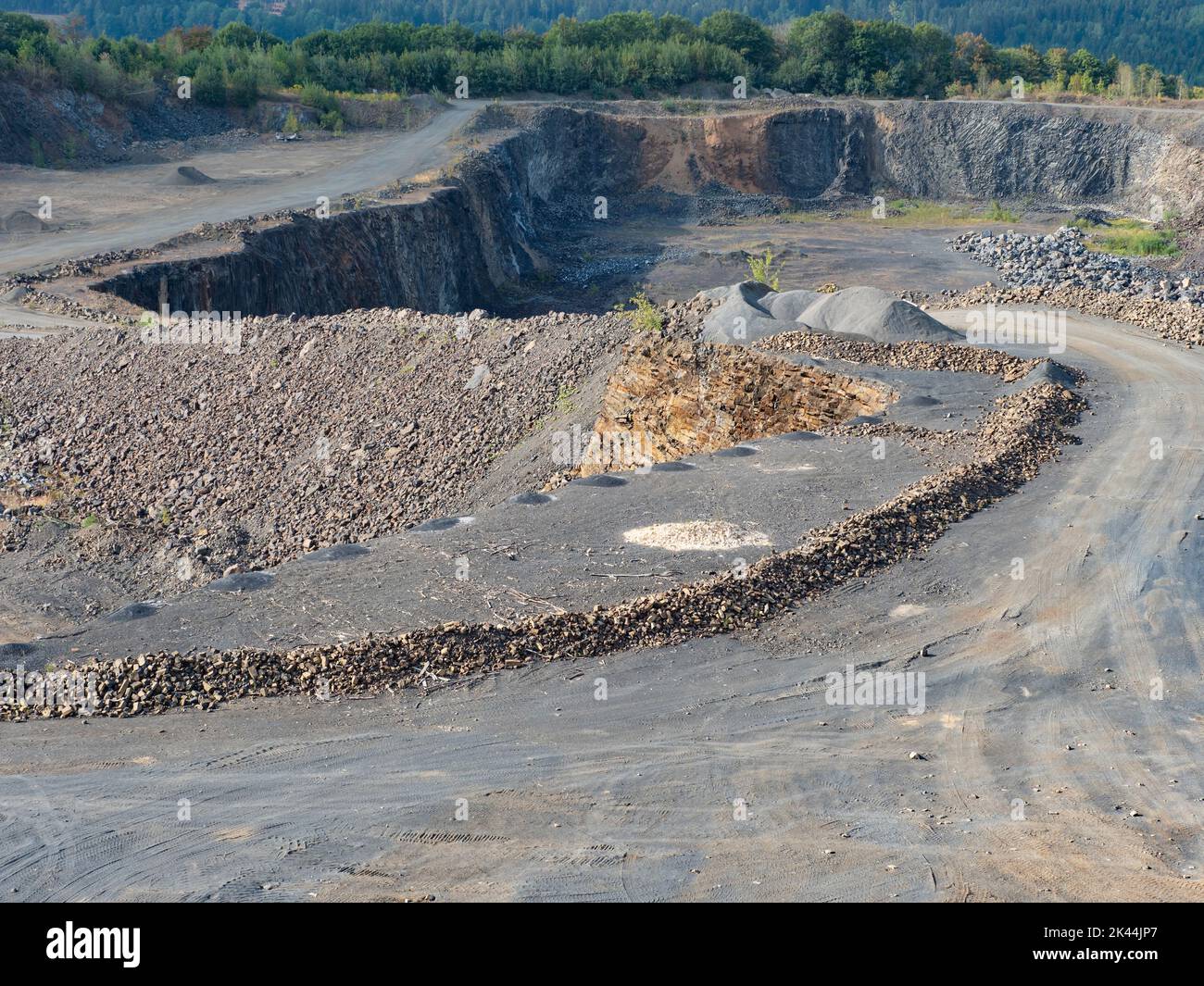 Open clinkstone or phonolite quarry. Black basalt stones mine. Industry ...