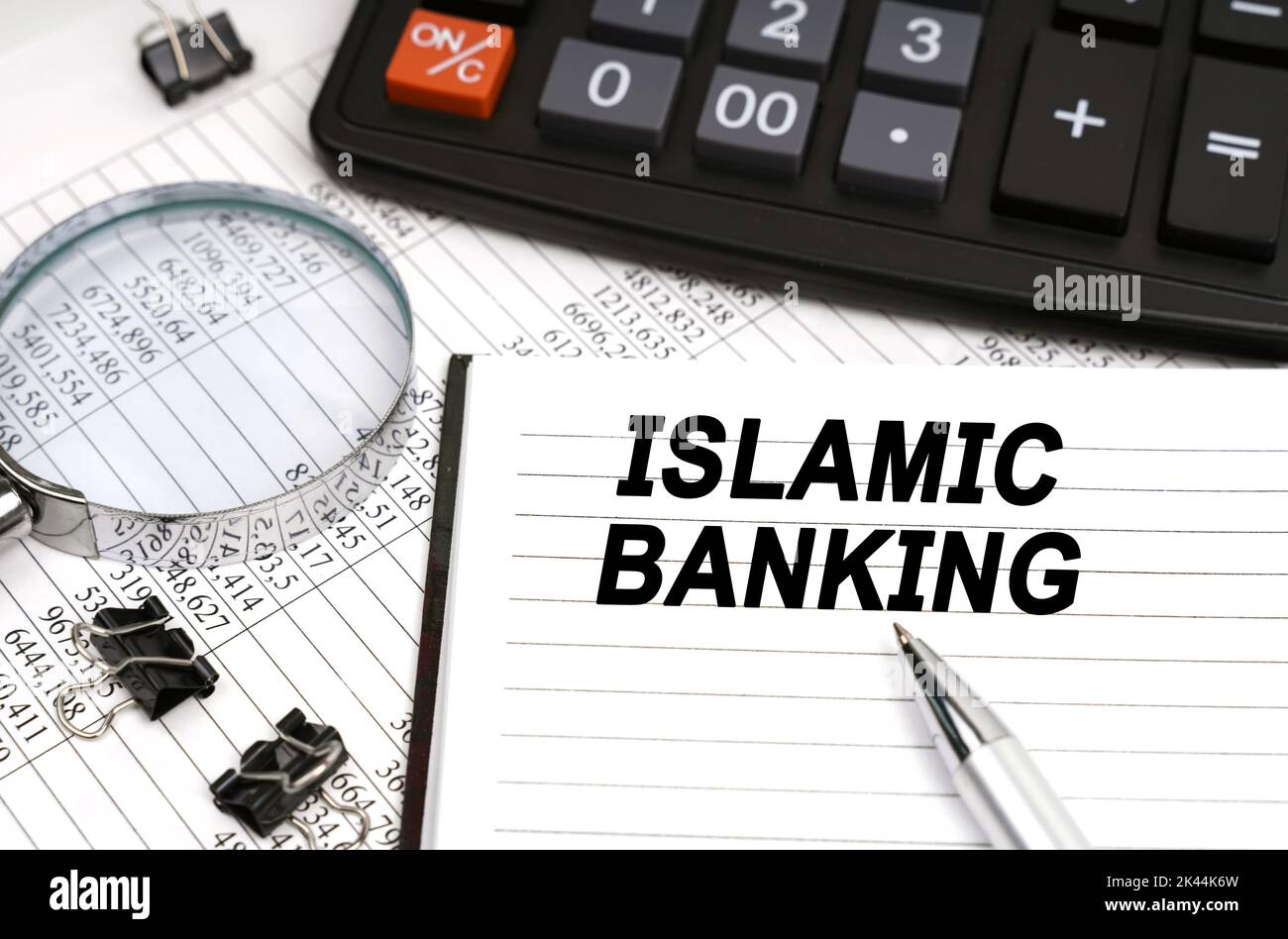 Business concept. On the table is a magnifying glass, a calculator, a ...