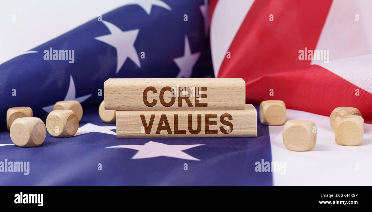 Business concept. The American flag has wooden cubes and plaques that ...
