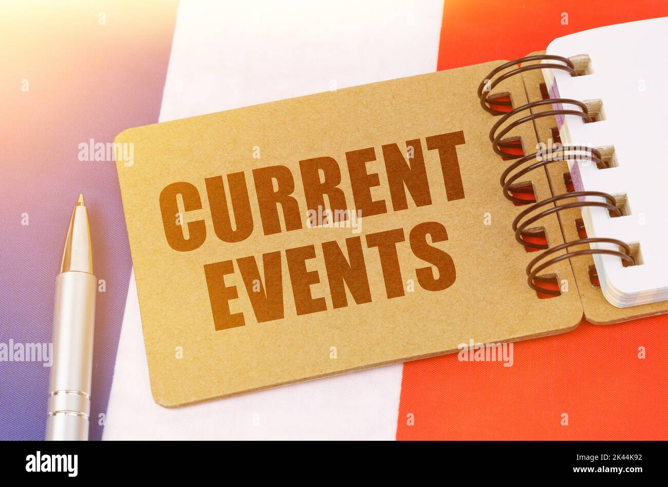 National economy concept. On the flag of France lies a notebook with ...