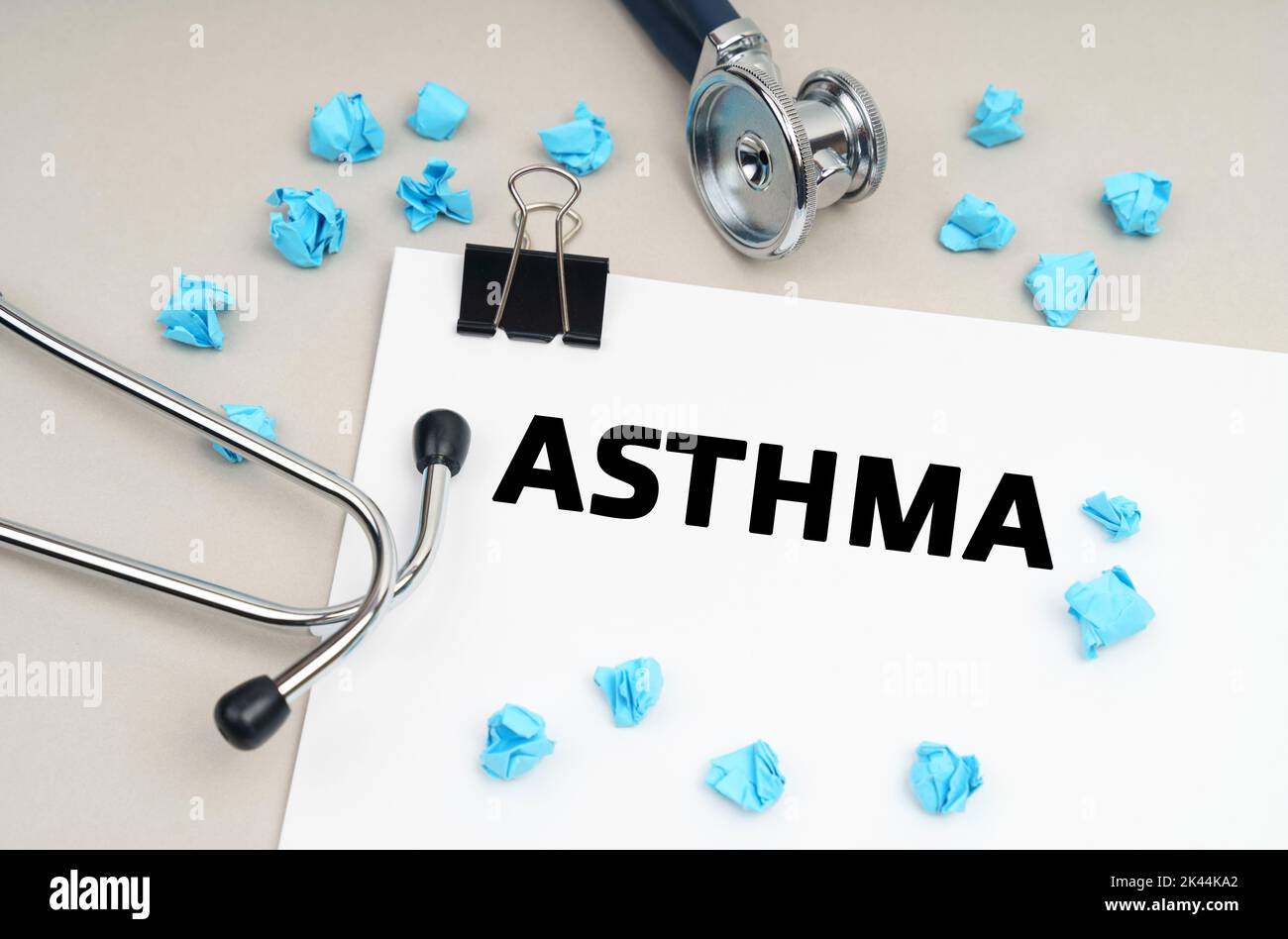 Medicine concept. On the table is a stethoscope, a pen, blue crumpled ...