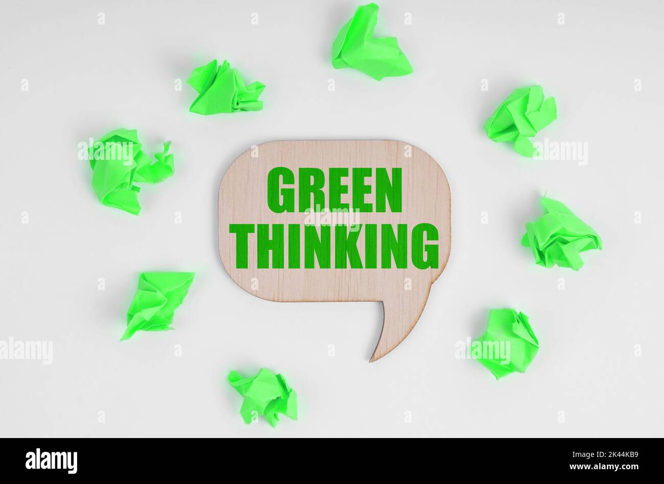 Ecology concept. On a white background, there are crumpled green pieces ...